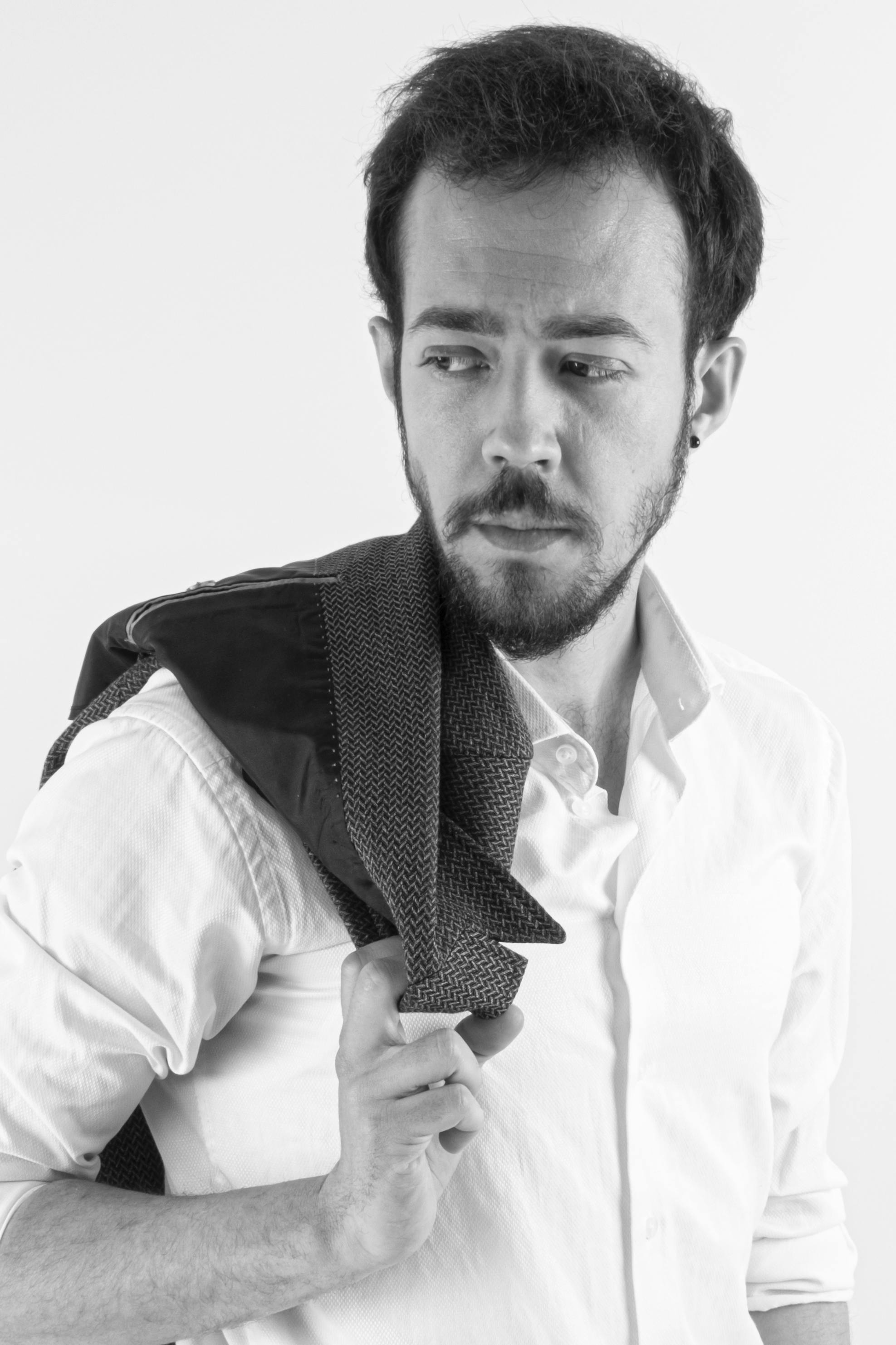 Grayscale Photo of a Man in White Long Sleeves · Free Stock Photo