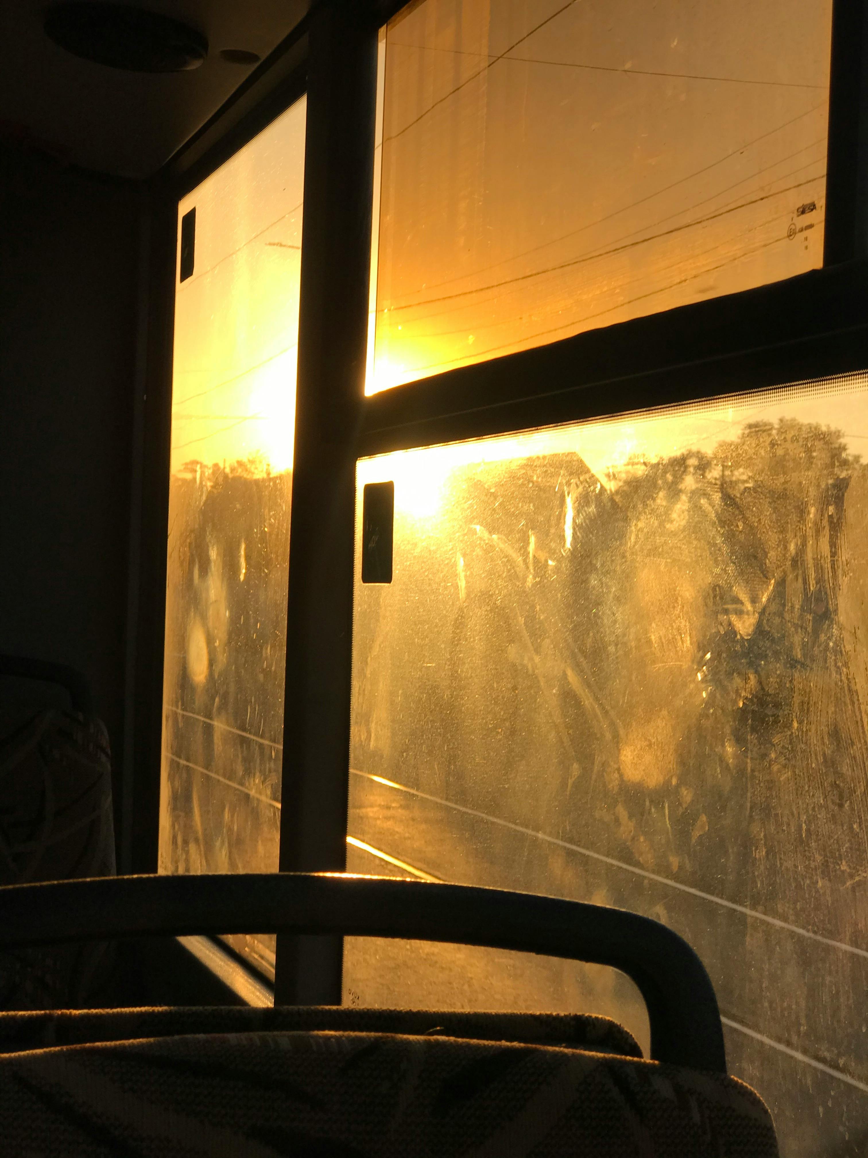 Sun Peaking Through the Bus Window · Free Stock Photo
