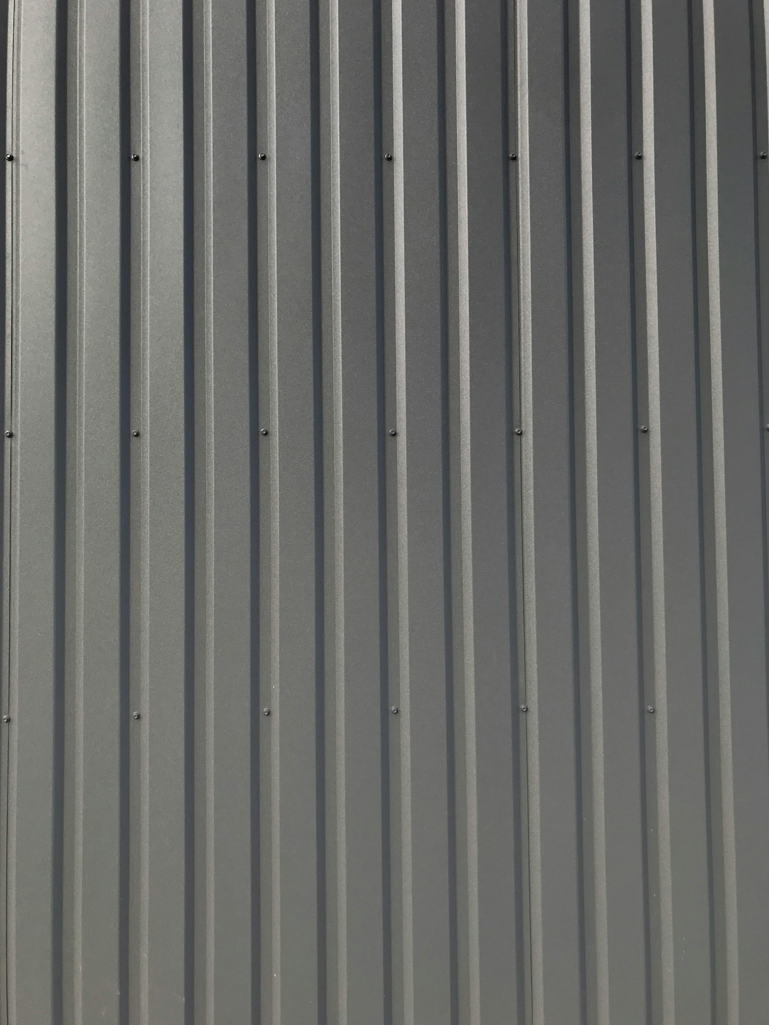 Closeup of a Gray Corrugated Fence · Free Stock Photo