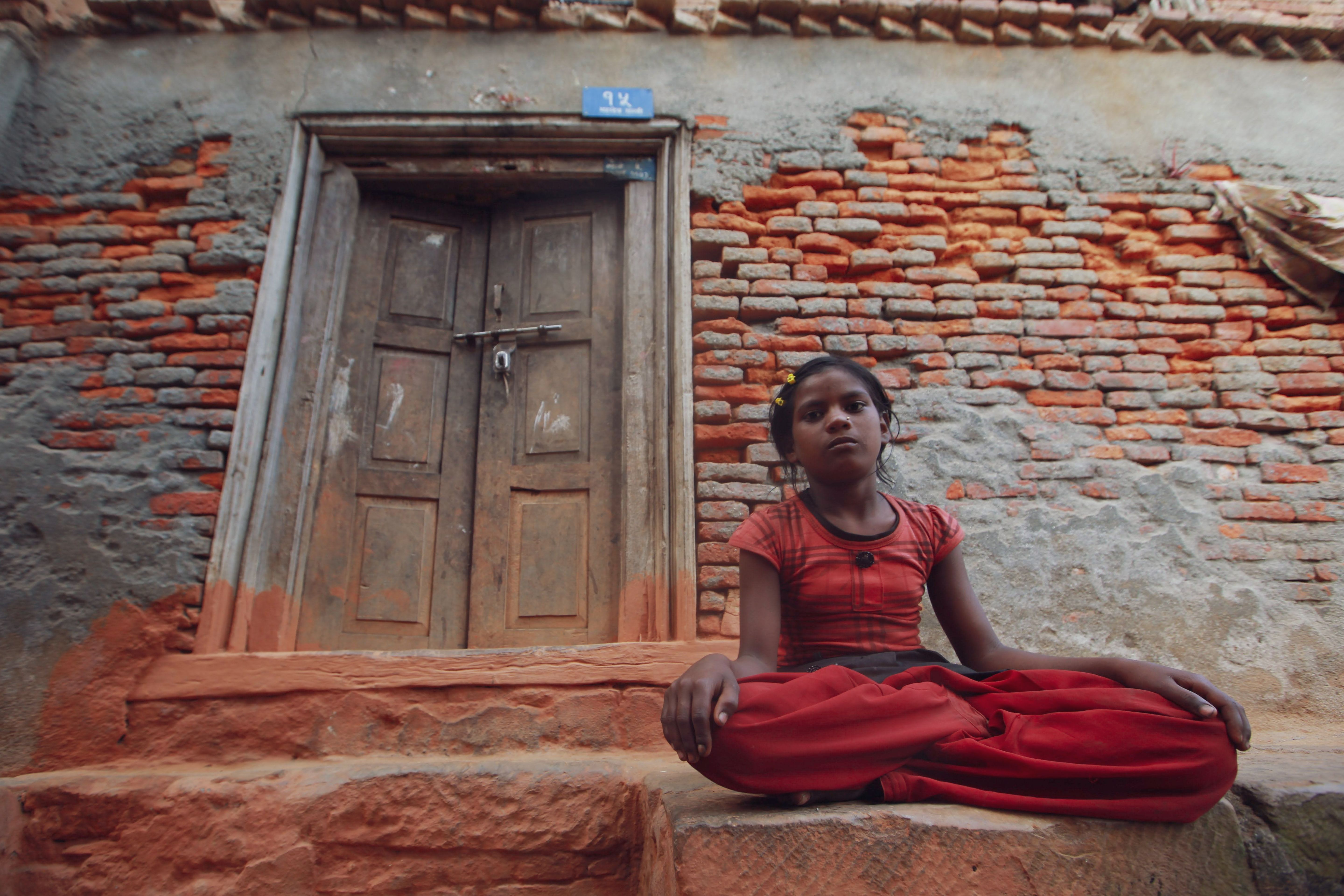 Crying Child Standing on a Doorway · Free Stock Photo