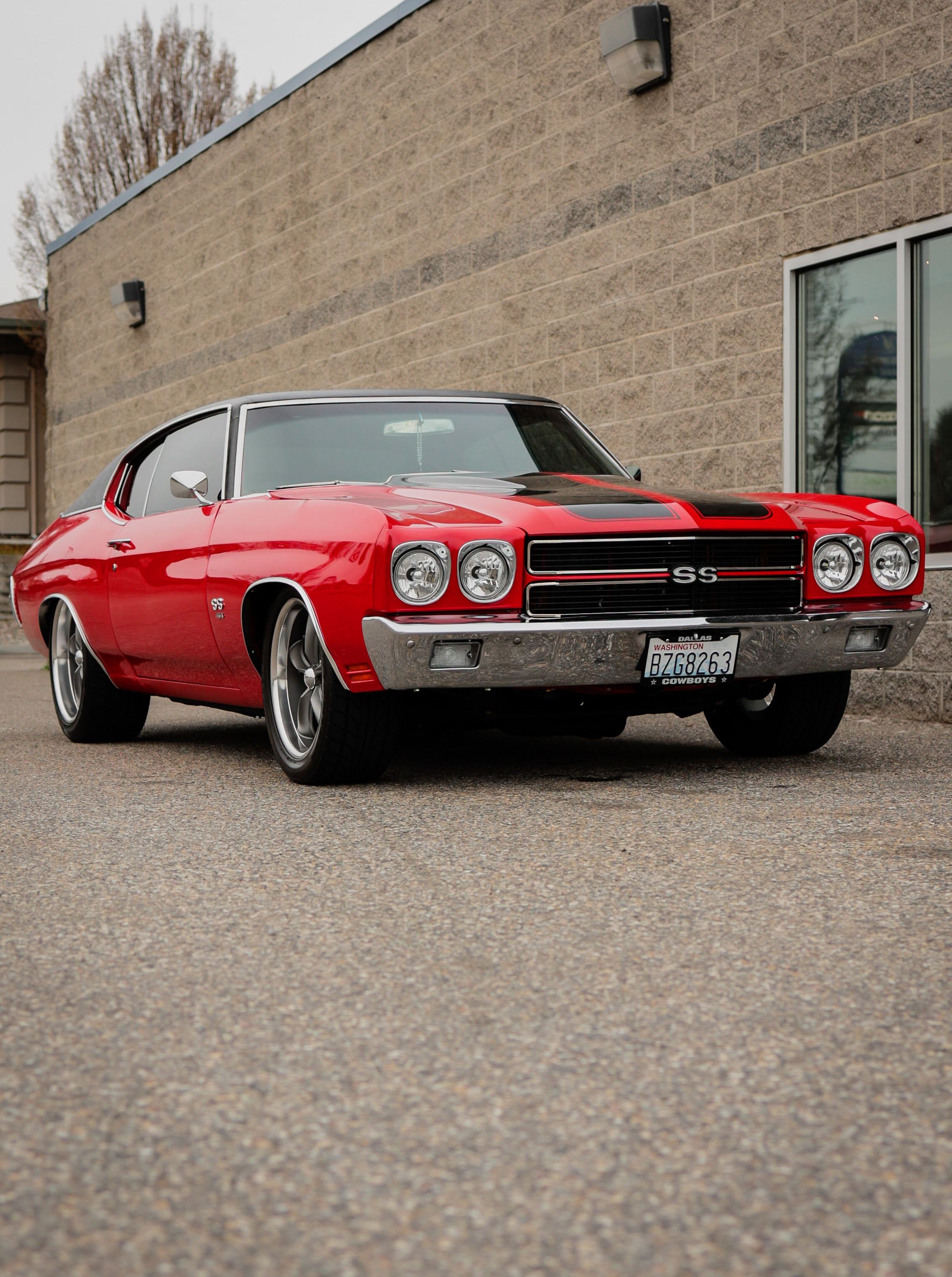 Classic Red Coupe Park Inside Building · Free Stock Photo