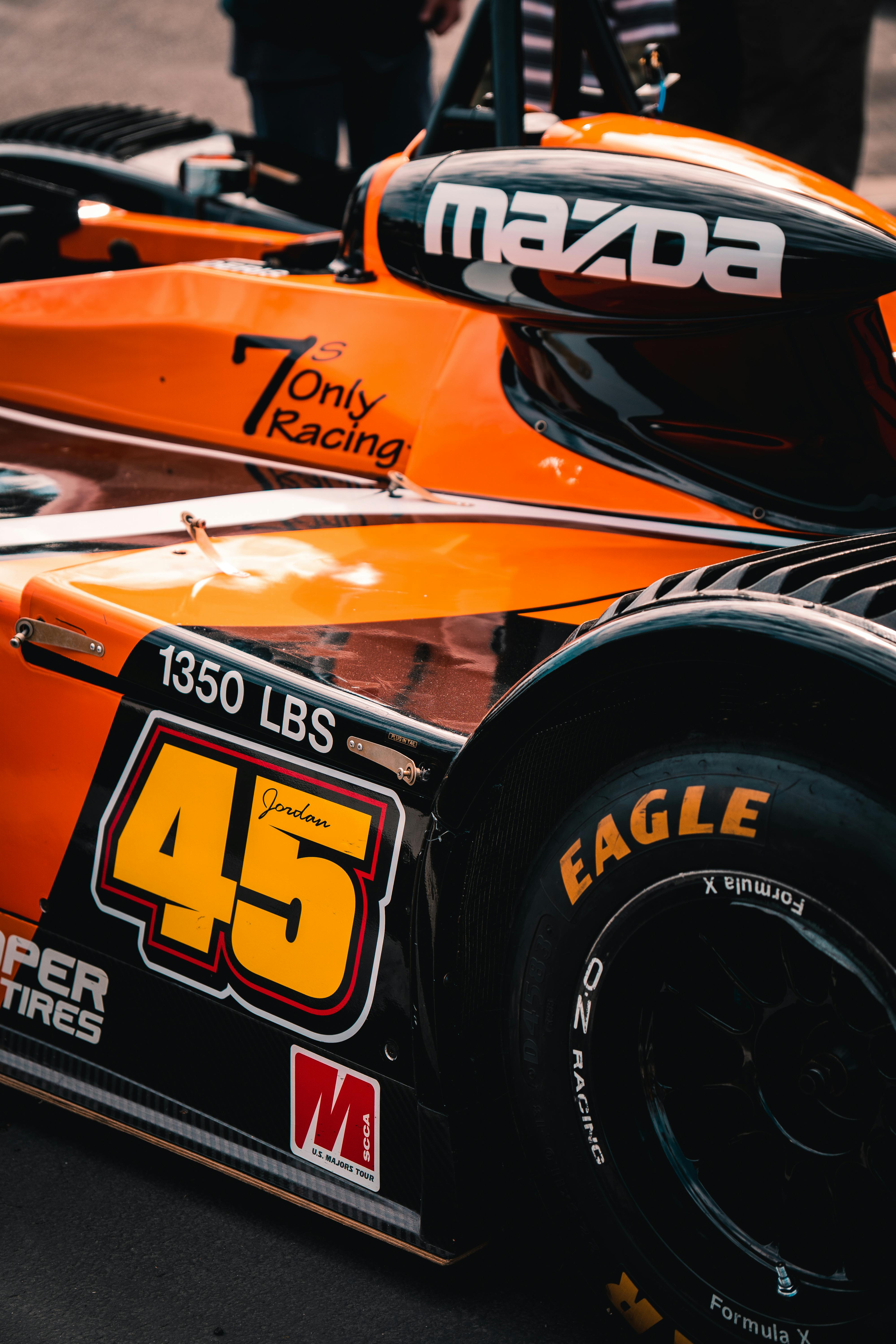 An Orange and Black Race Car · Free Stock Photo