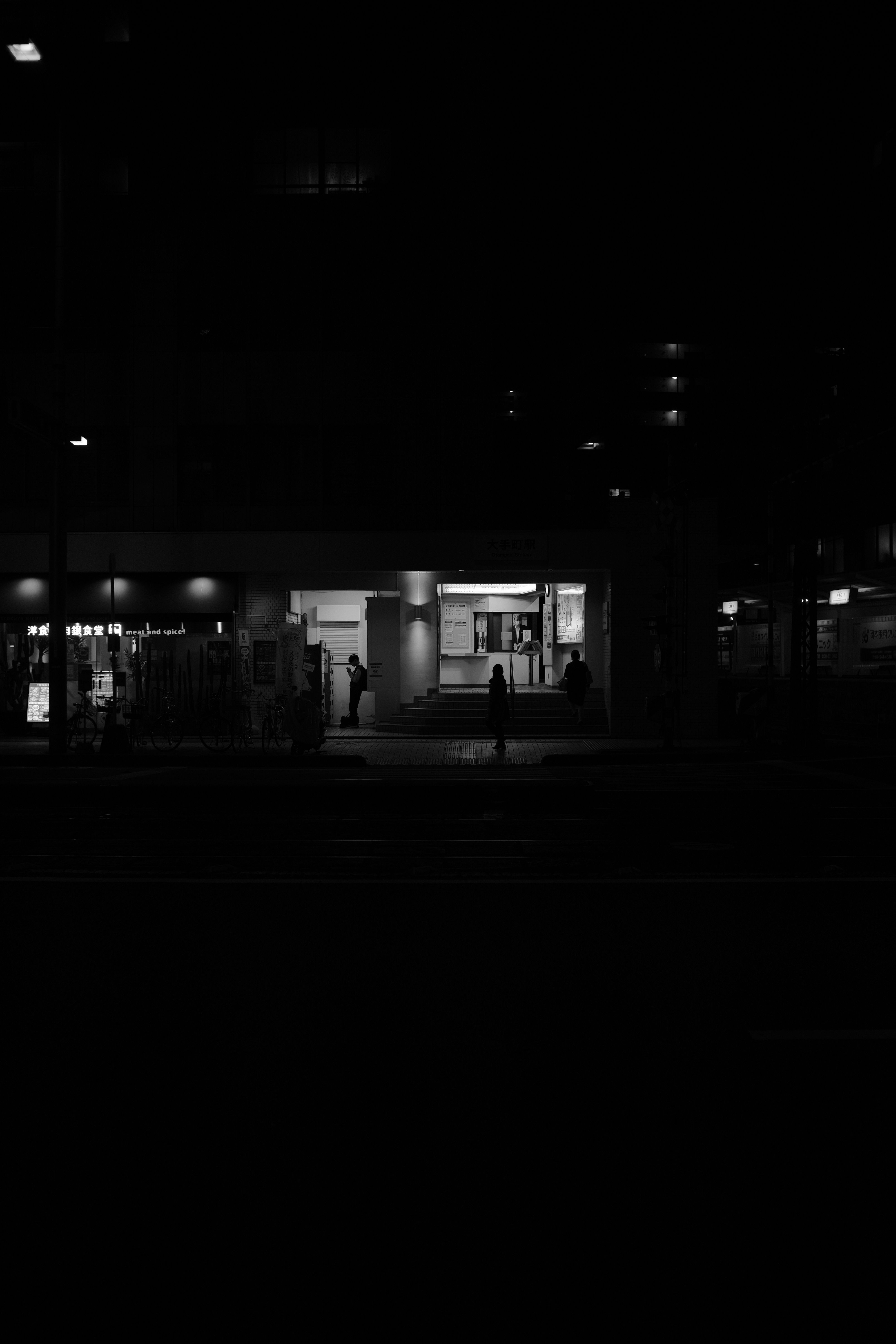A Grayscale of a Building Illuminated at Night · Free Stock Photo