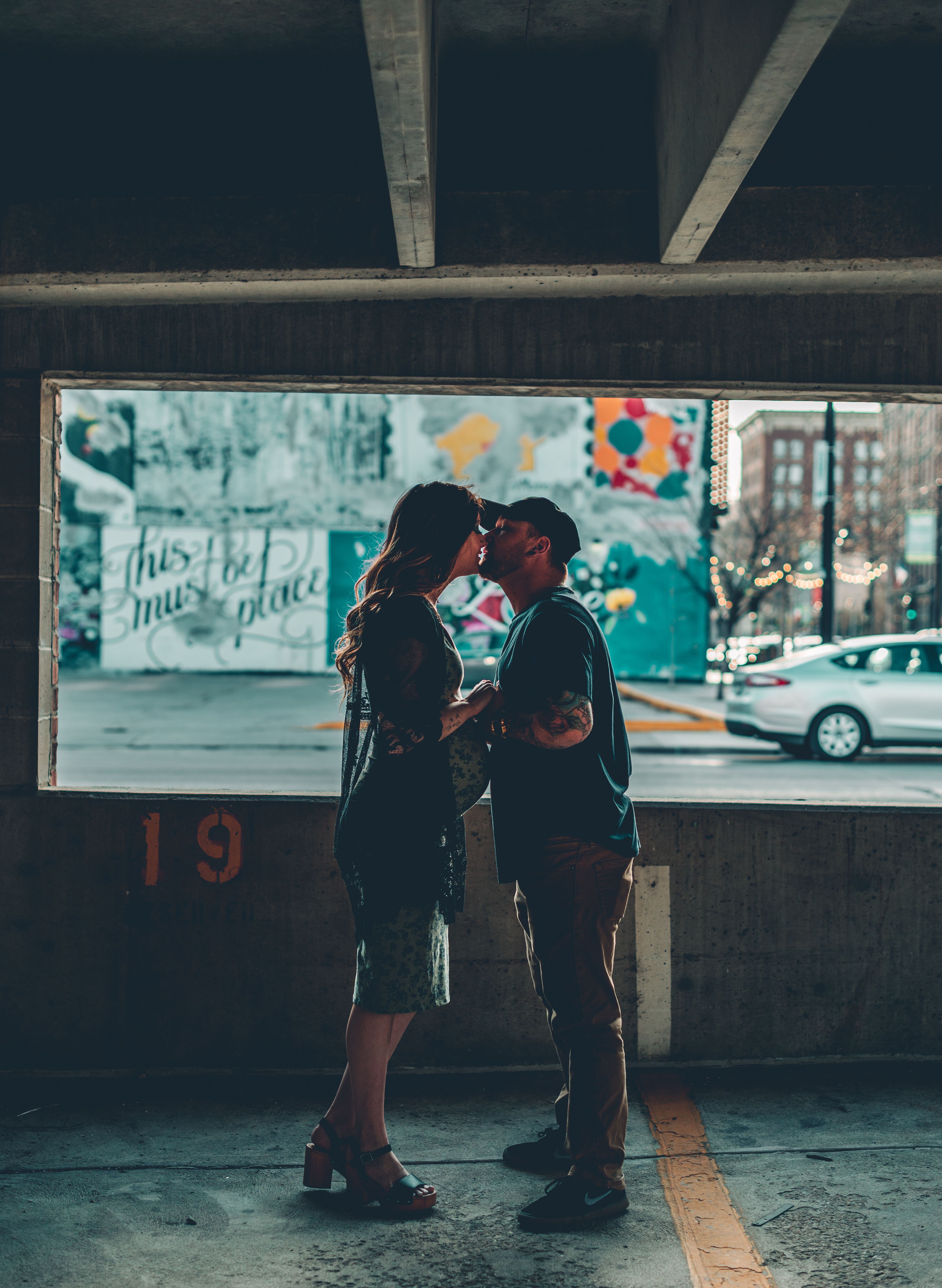 Indian Couple Kissing Among Cars · Free Stock Photo