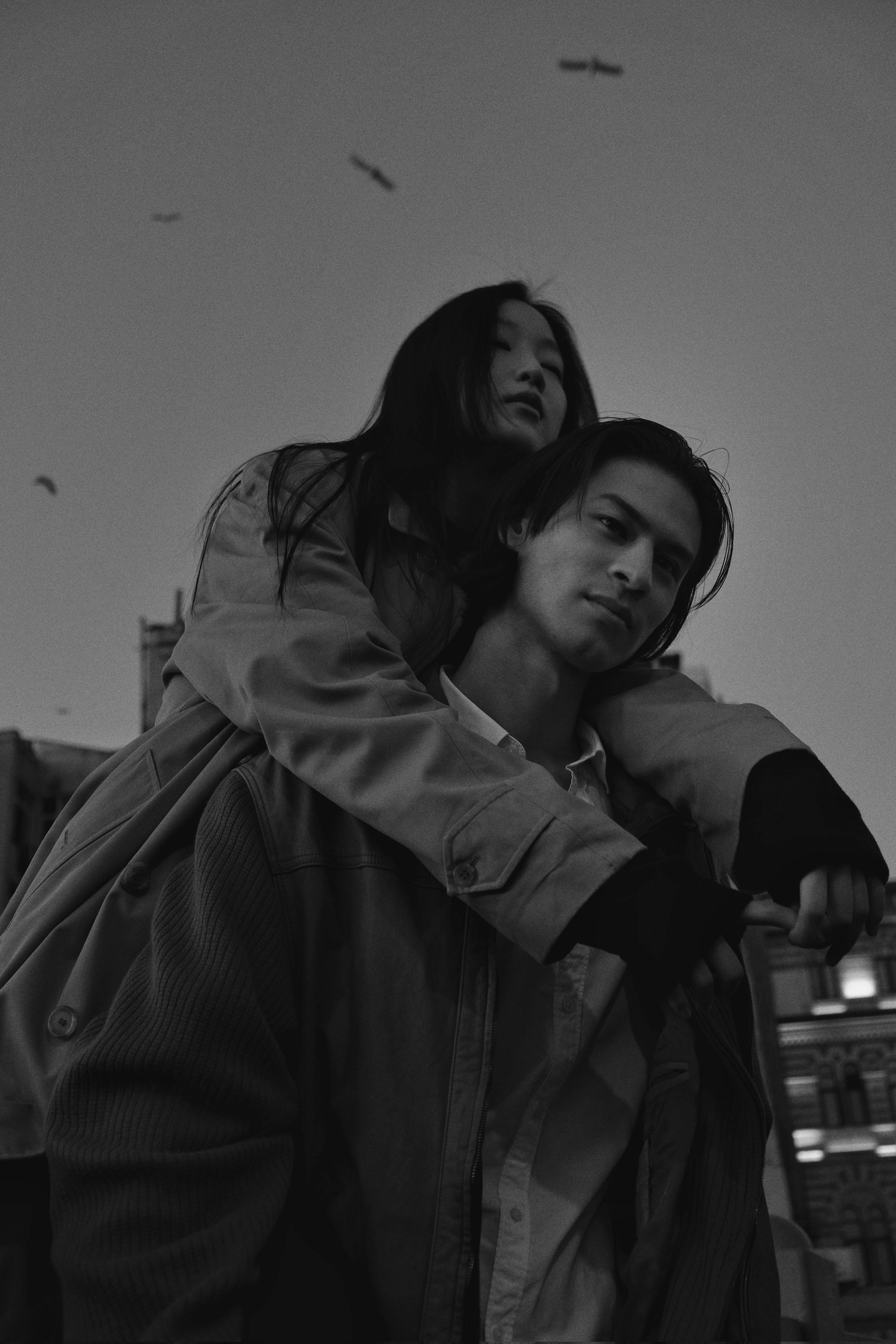 A Couple Leaning on Each Others Back · Free Stock Photo