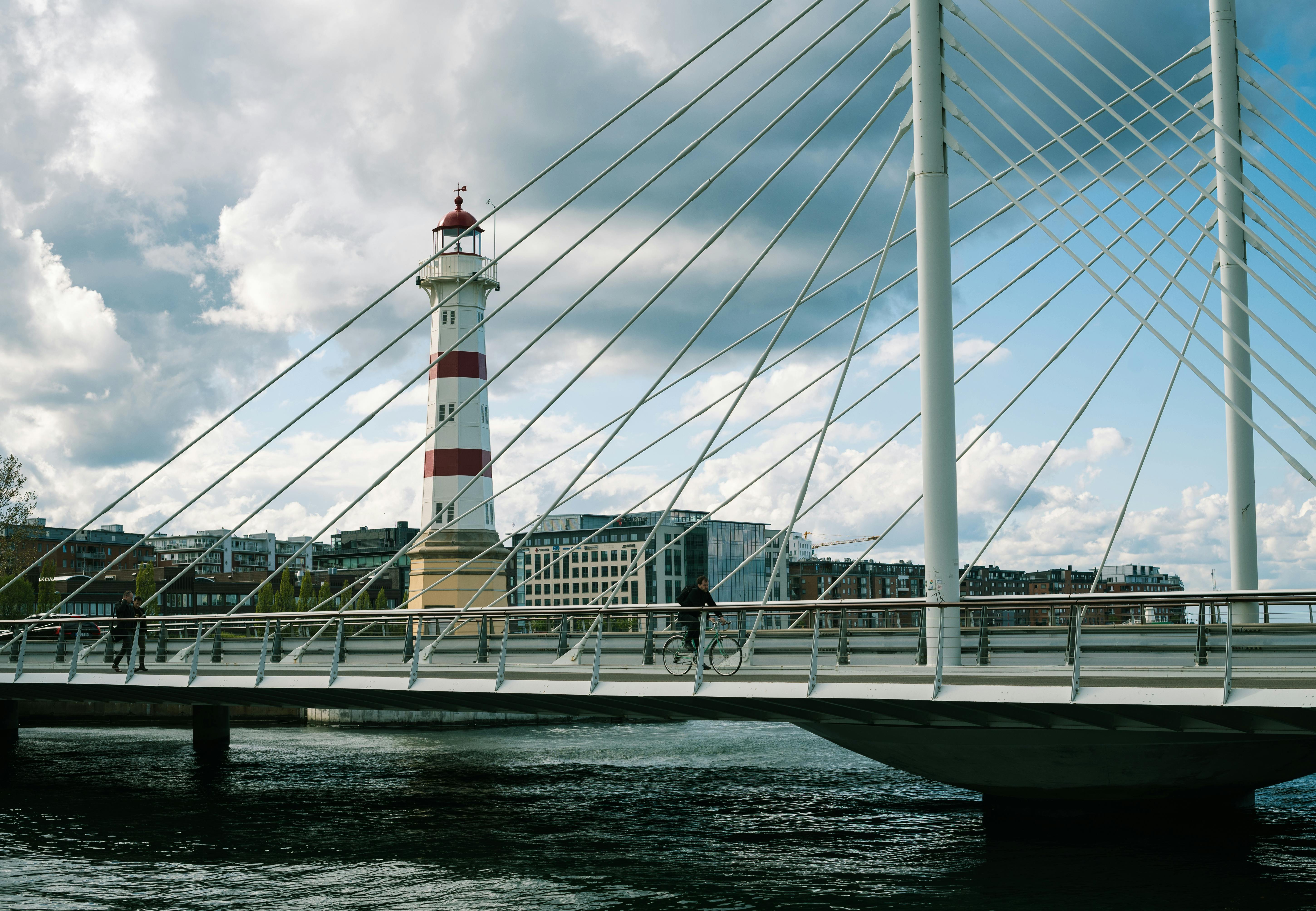 White and Red Lighthouse on the Bridge · Free Stock Photo