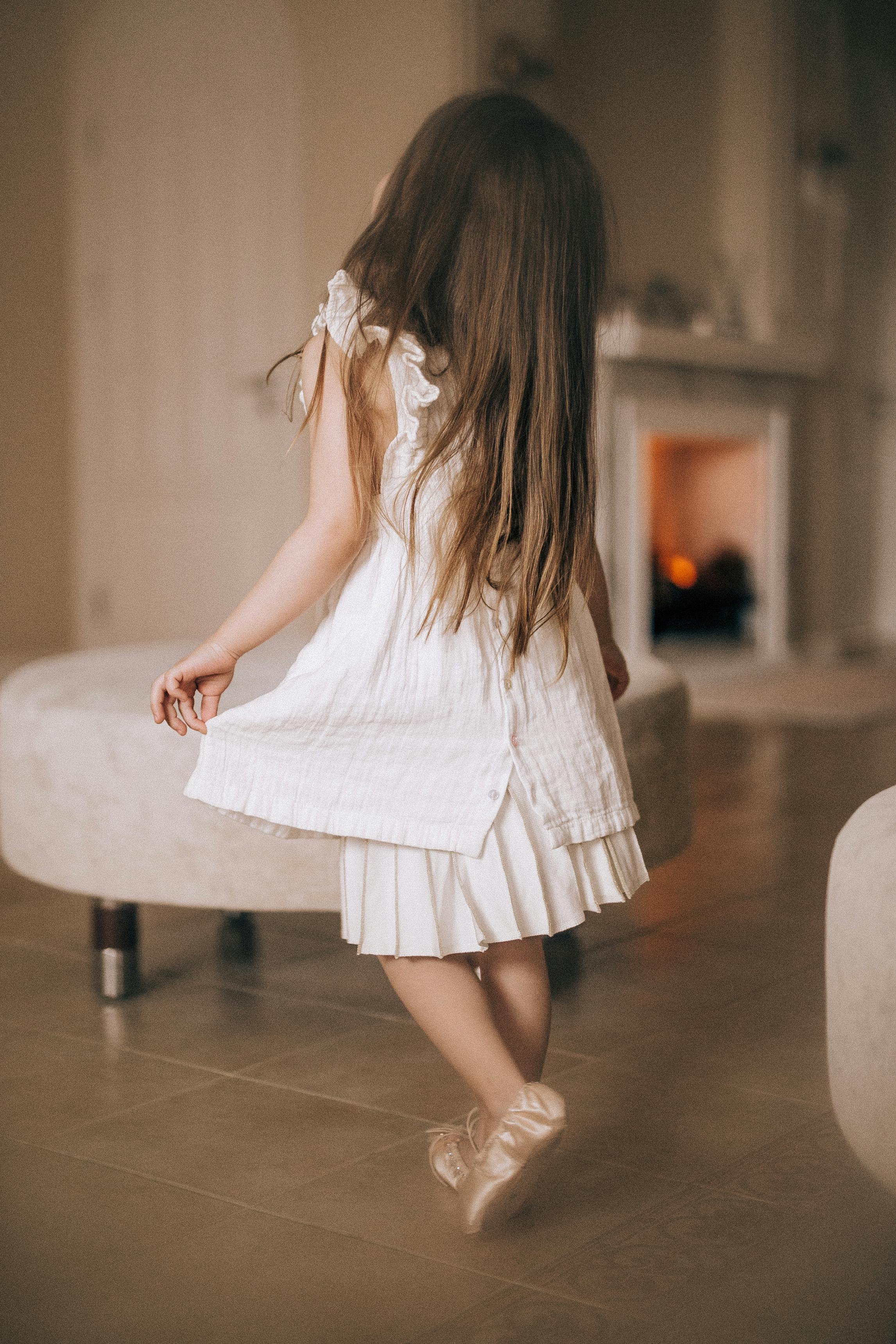 Back View of Little Girl in Dress and Ballet Shoes · Free Stock Photo