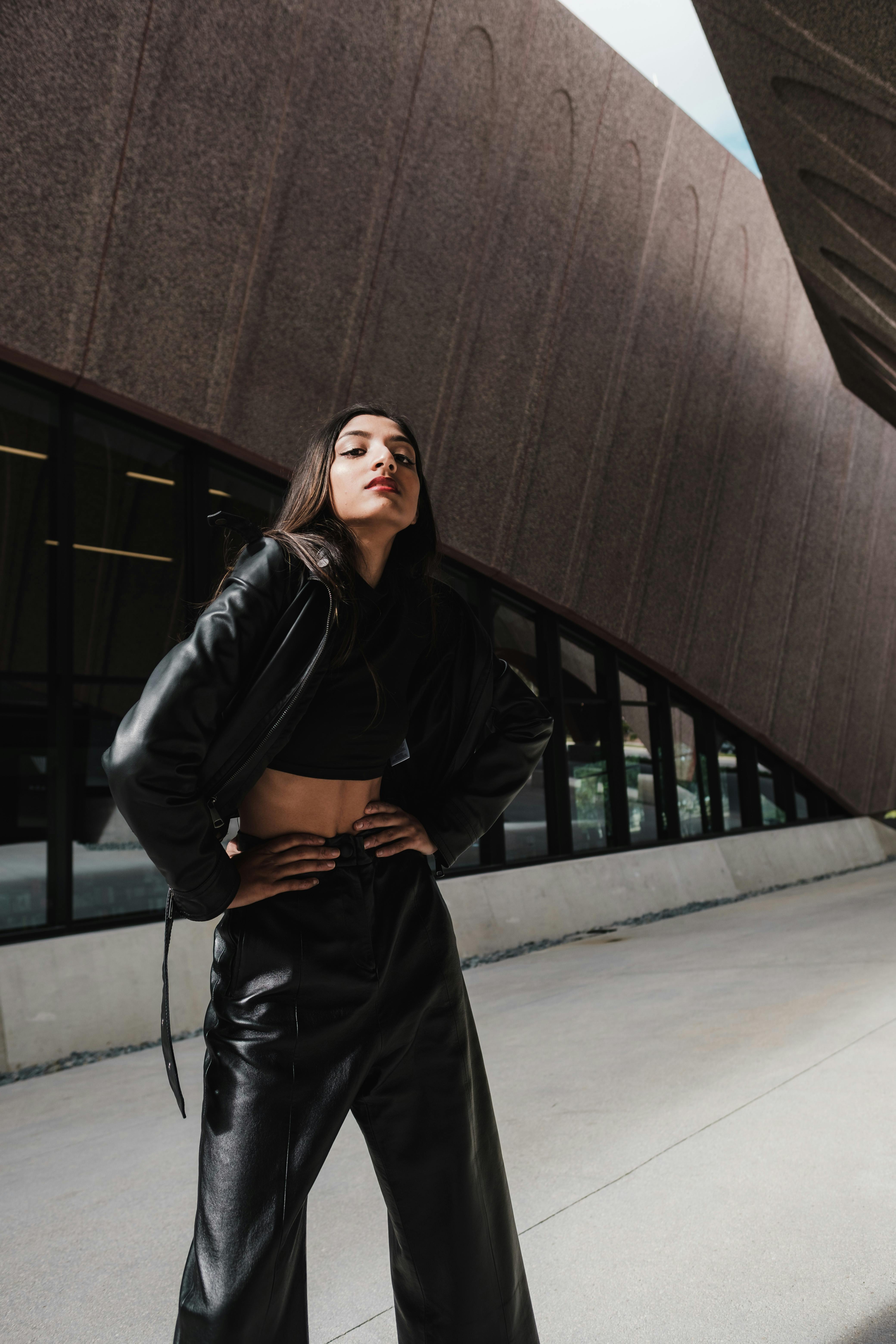 Woman in Leather Jacket Posing · Free Stock Photo