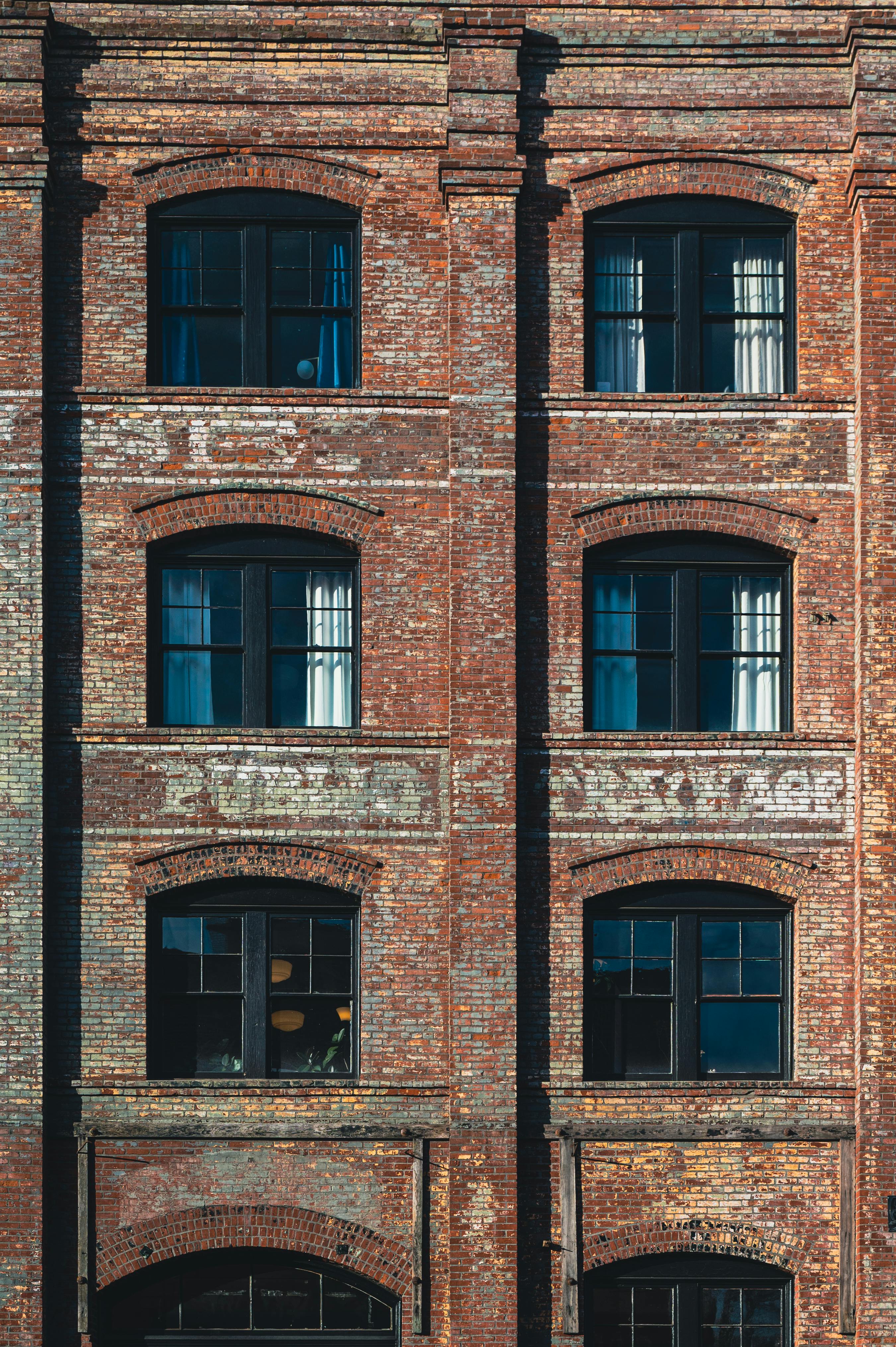 Photo of a Brick Building with Windows · Free Stock Photo