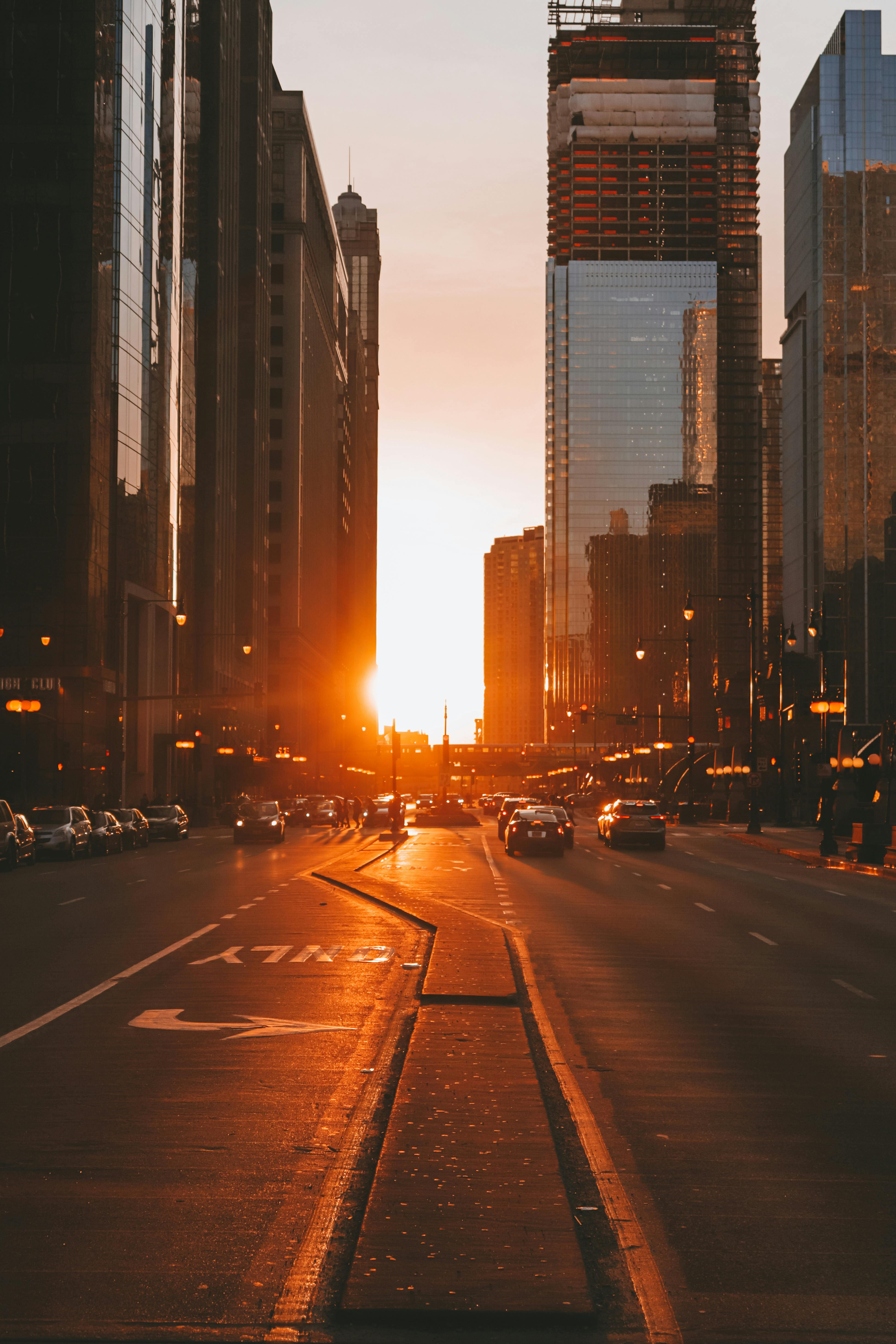 Cars on Road Near High Rise Buildings · Free Stock Photo