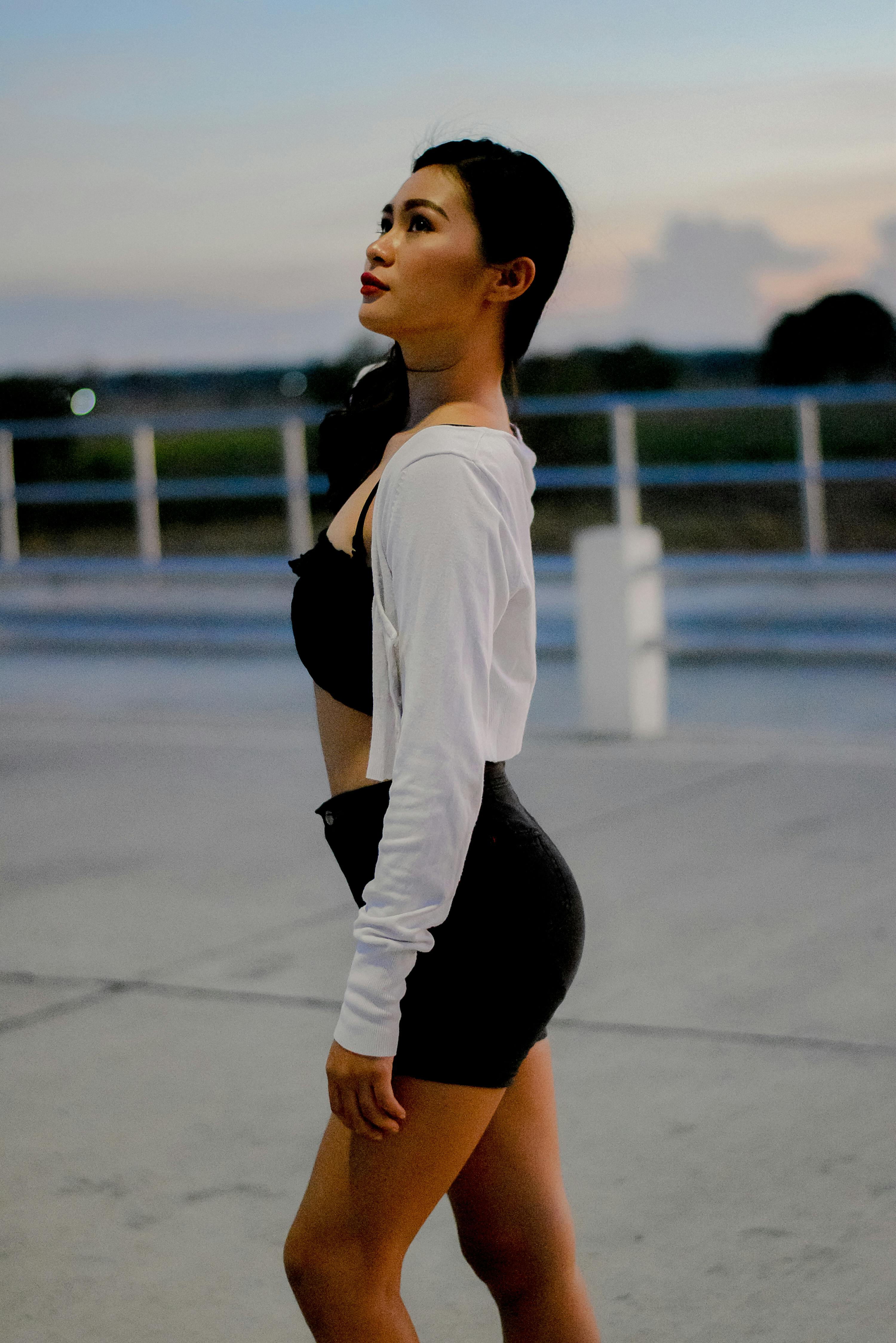 Woman in Black Shorts Looking Up · Free Stock Photo