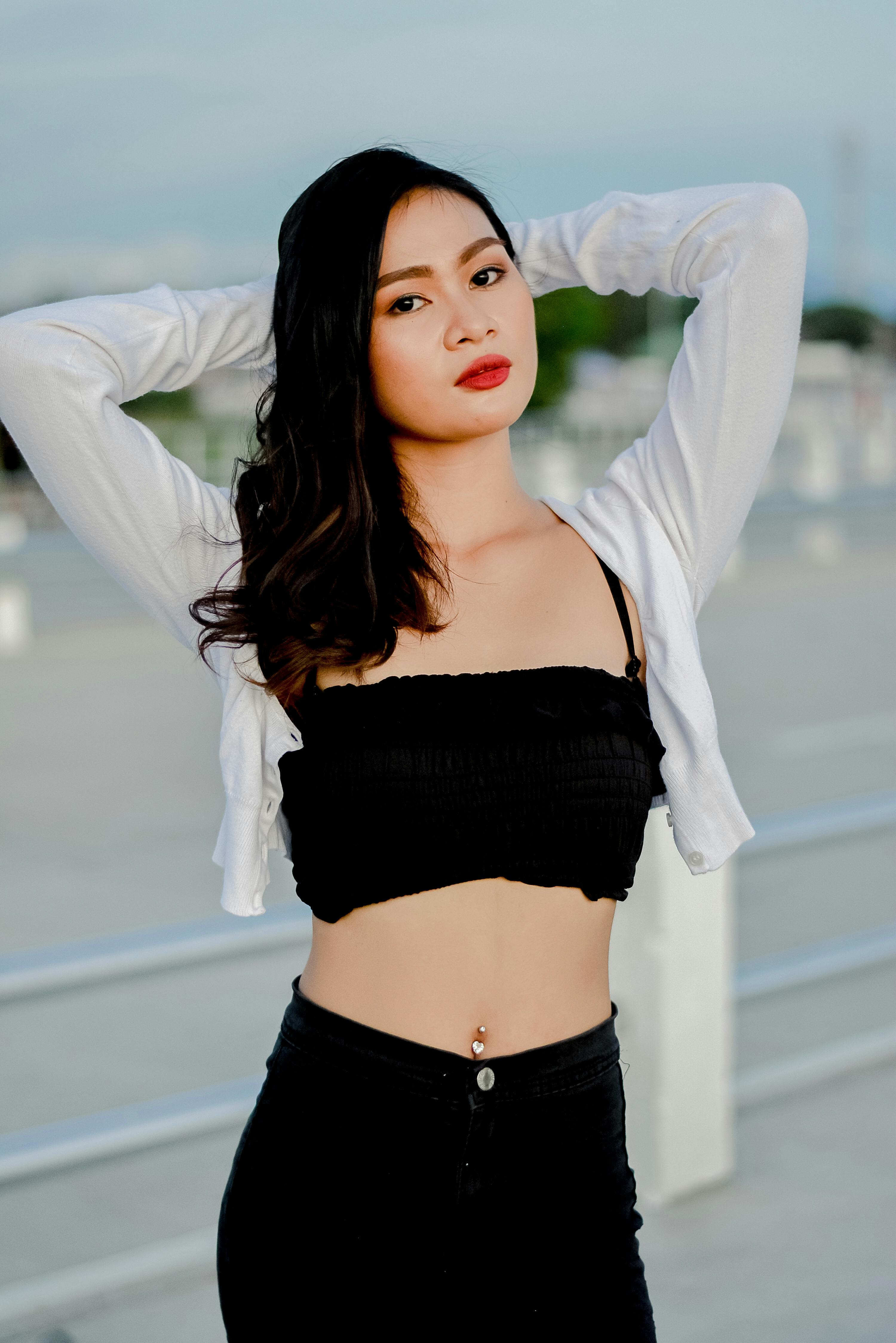 Woman Standing on the Stairs Outside a Building · Free Stock Photo