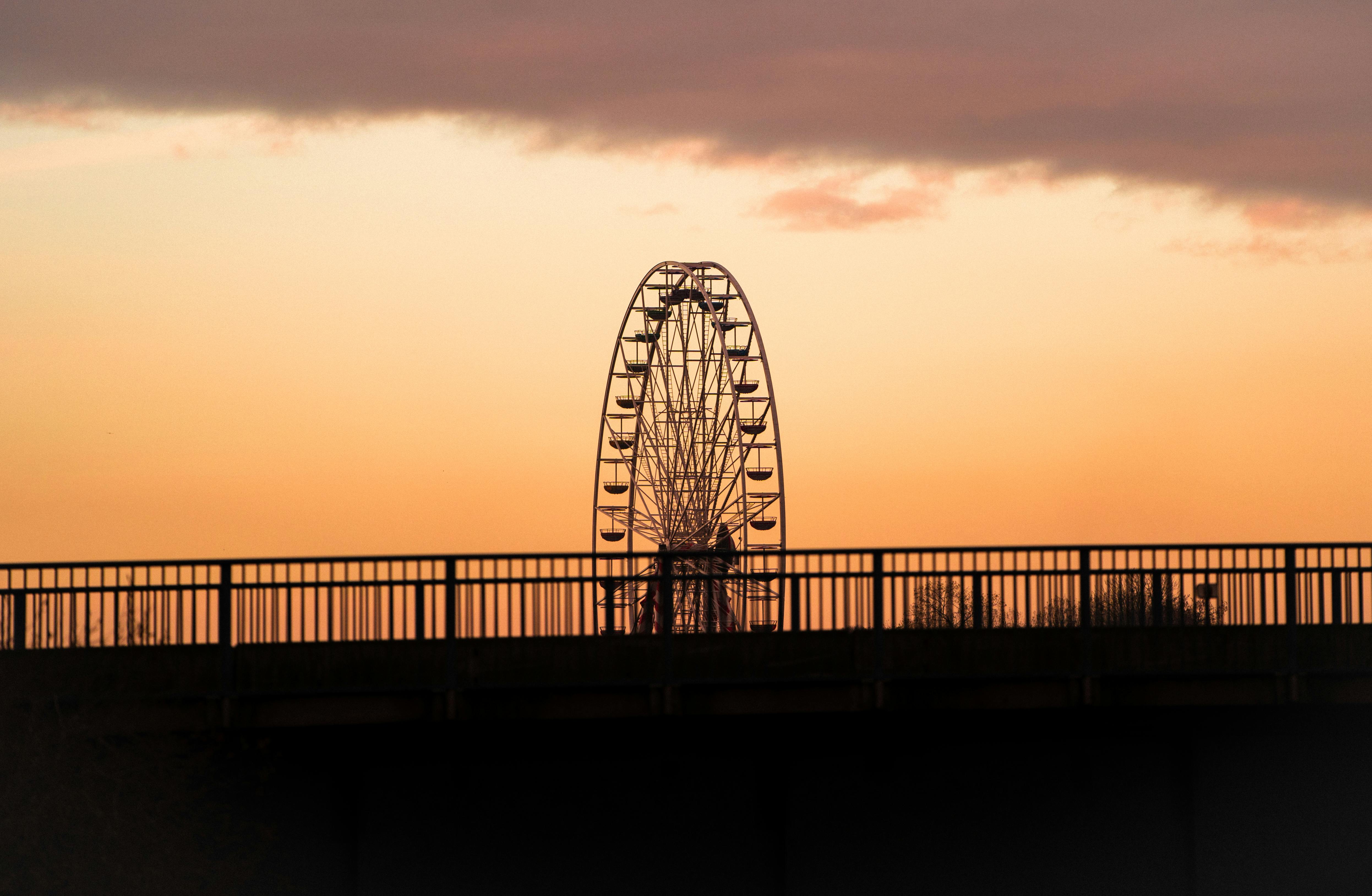 Distant View of Fairground at Sunset · Free Stock Photo