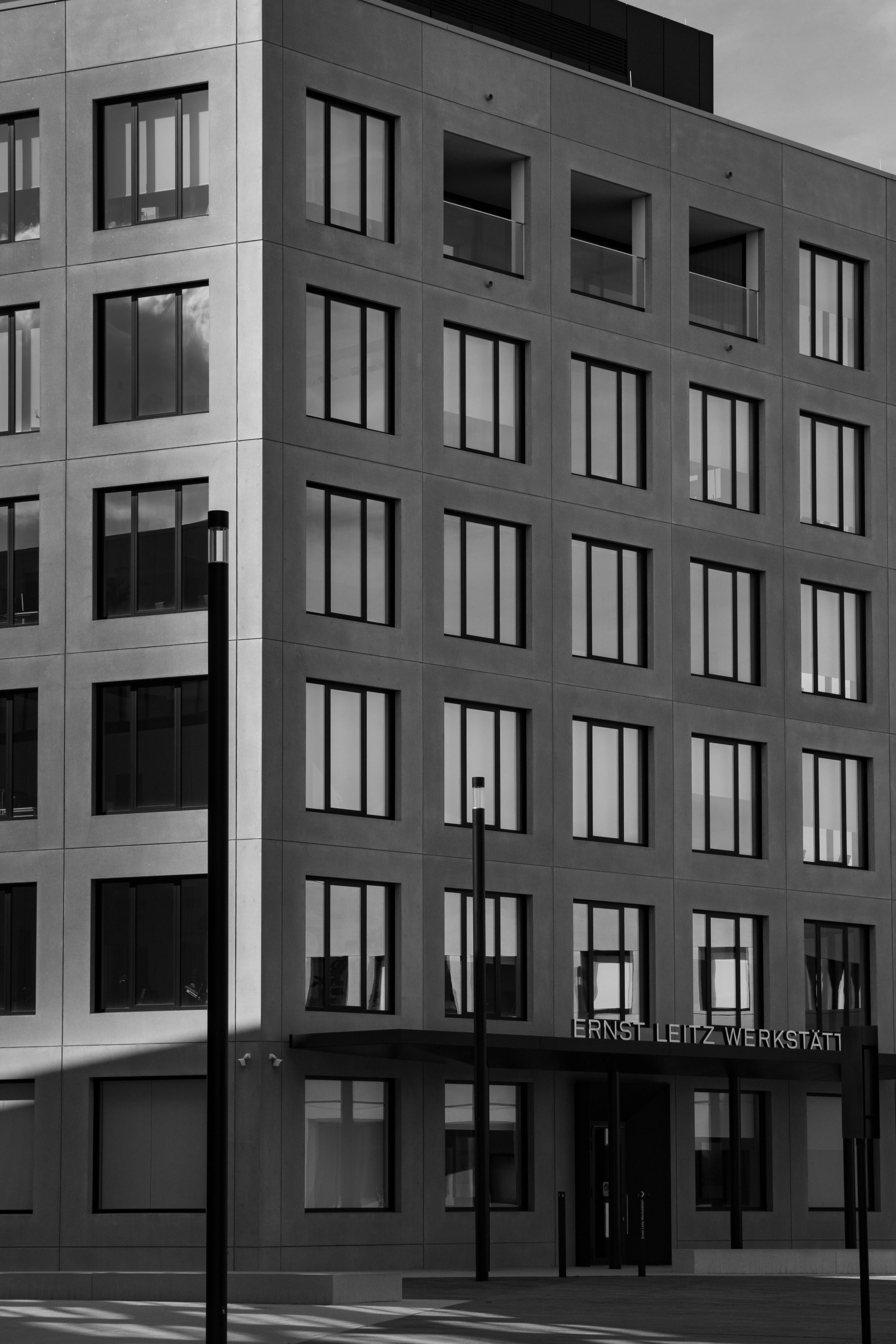 Grayscale Photo of Concrete Building · Free Stock Photo