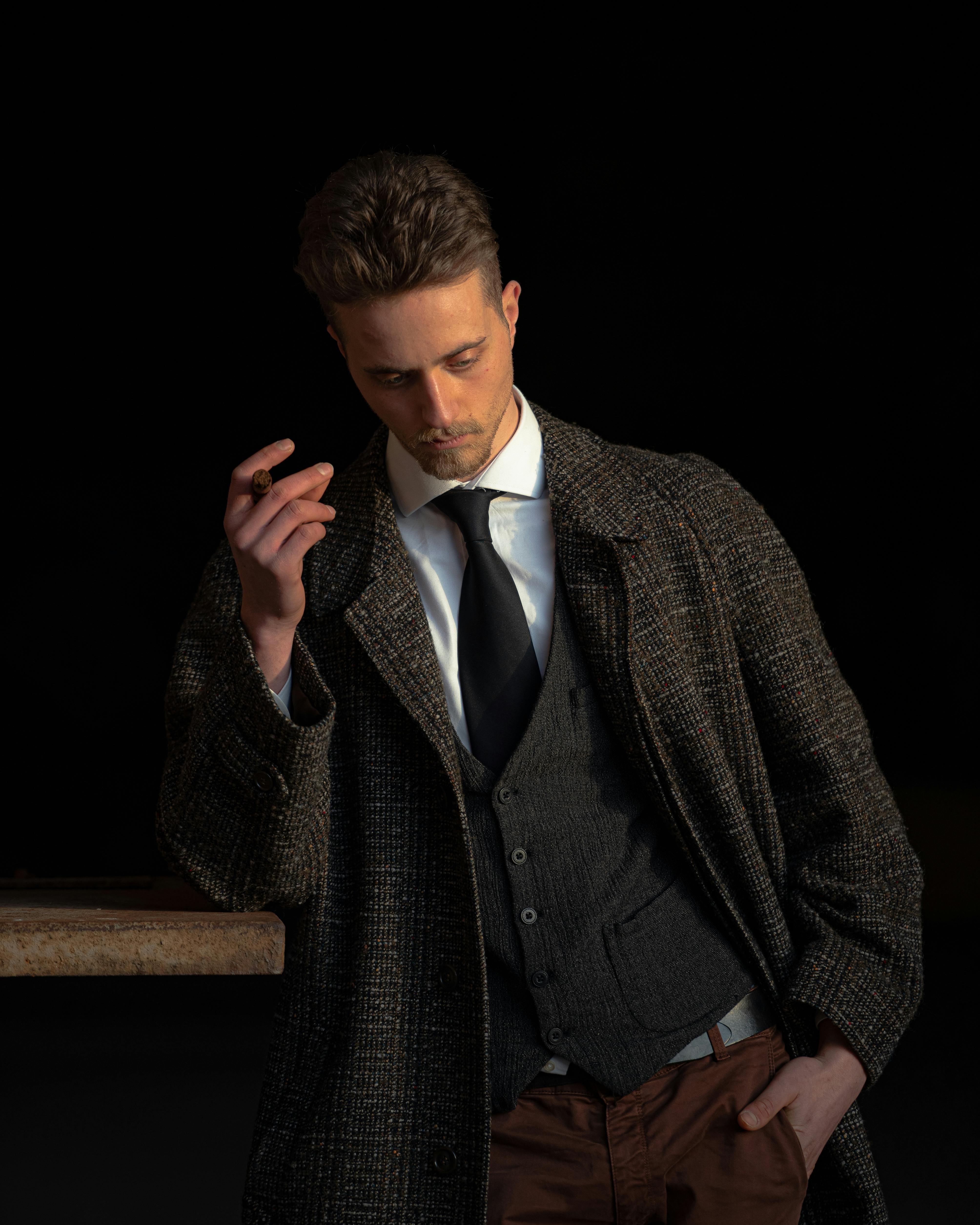 Elegant Man in Suit Smoking Cigar · Free Stock Photo