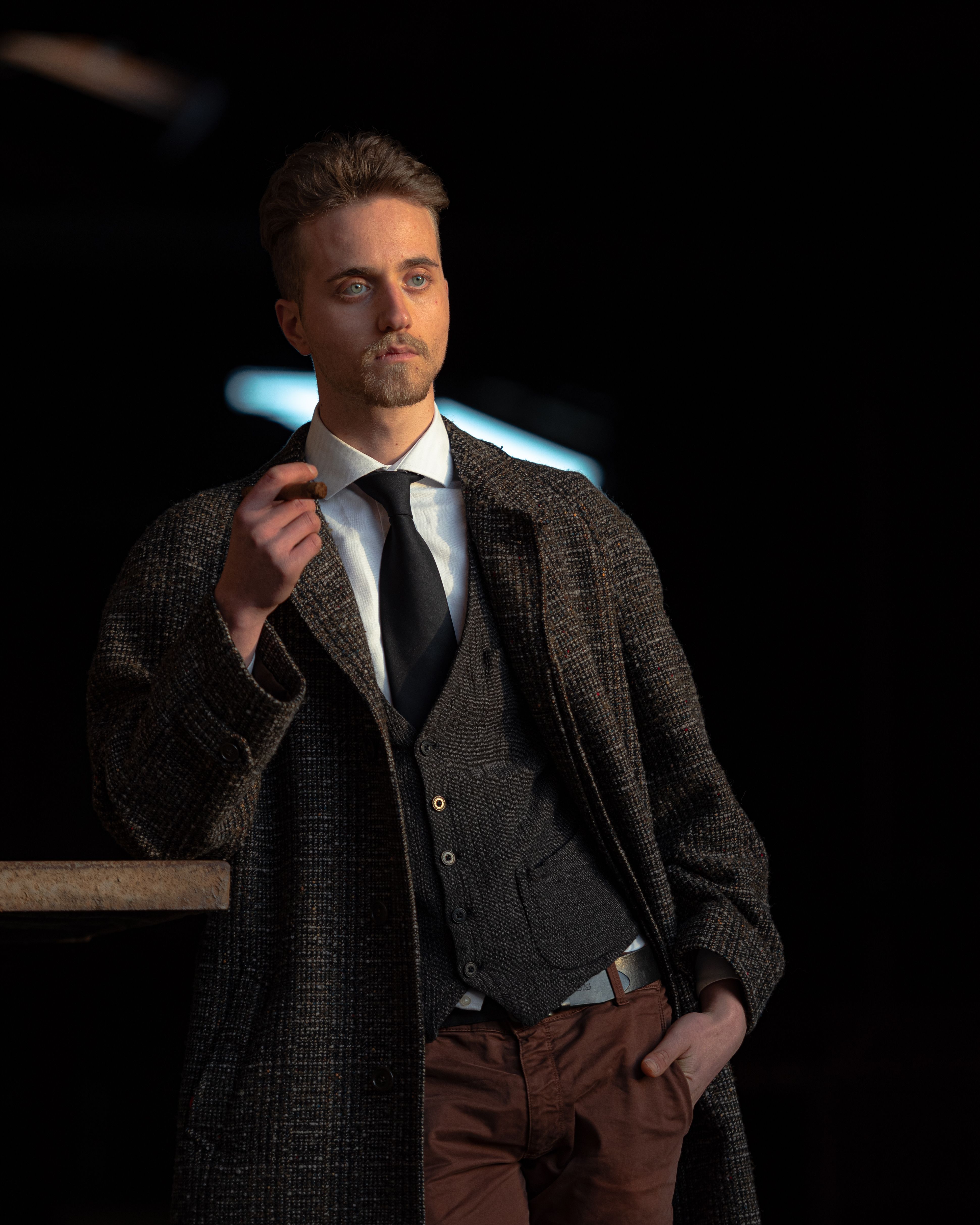 Man Standing in Provocative Pose Wearing Brown Jacket · Free Stock Photo
