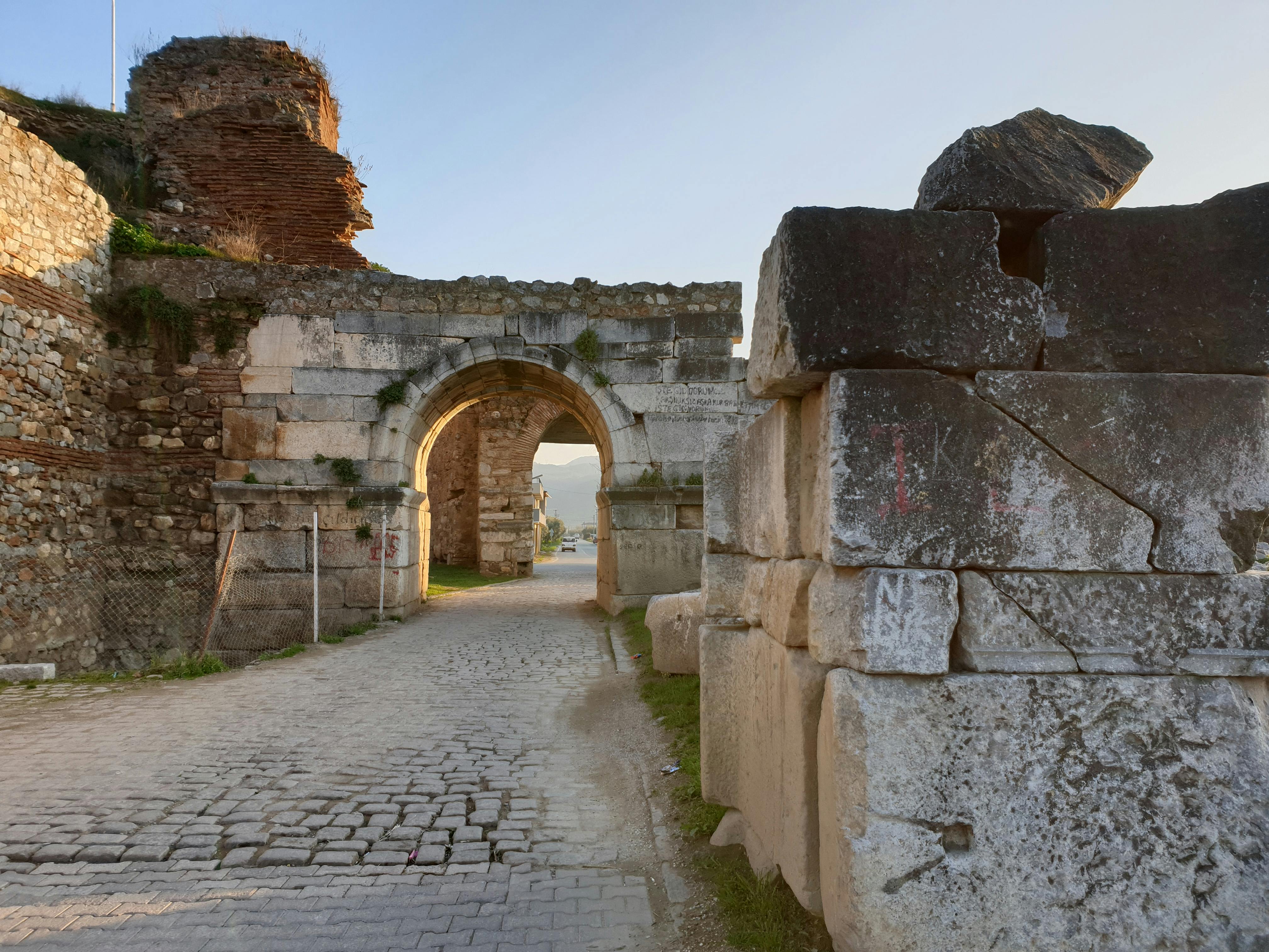 Gray Concrete Arch on Gray Concrete Pathway · Free Stock Photo