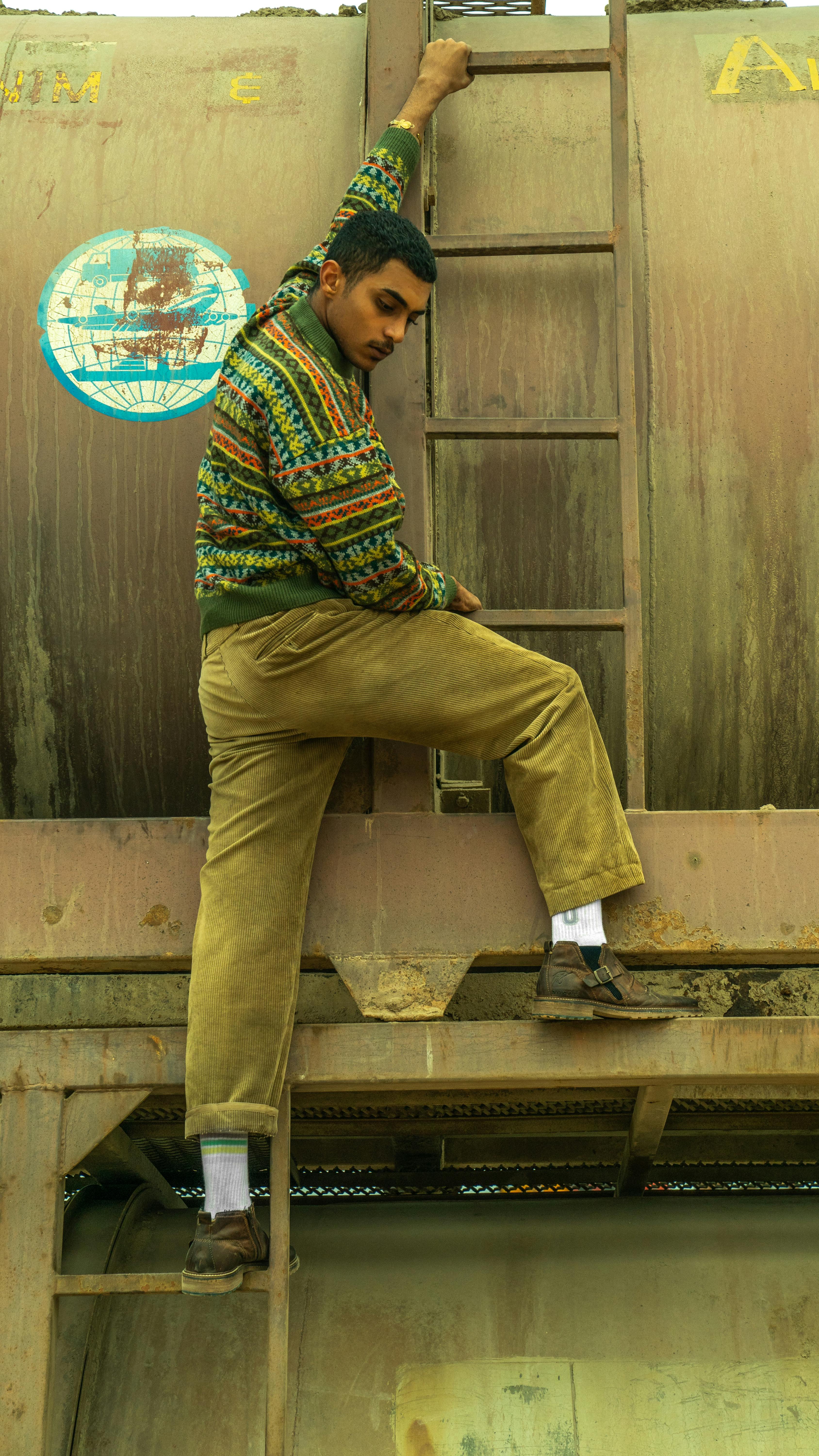 Man Climbing a Ladder · Free Stock Photo