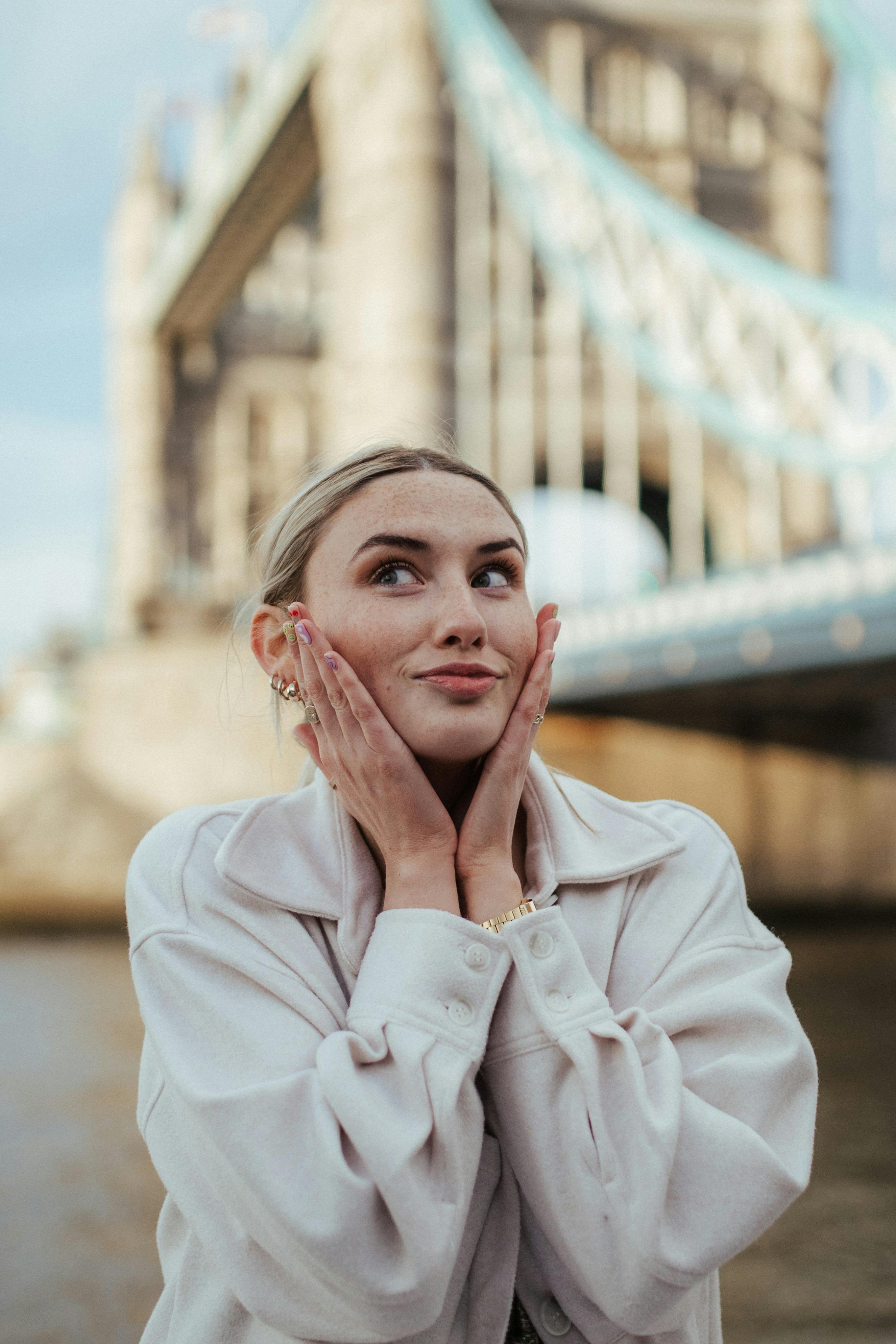 Portrait of Woman Cupping Her Face Between Hands · Free Stock Photo