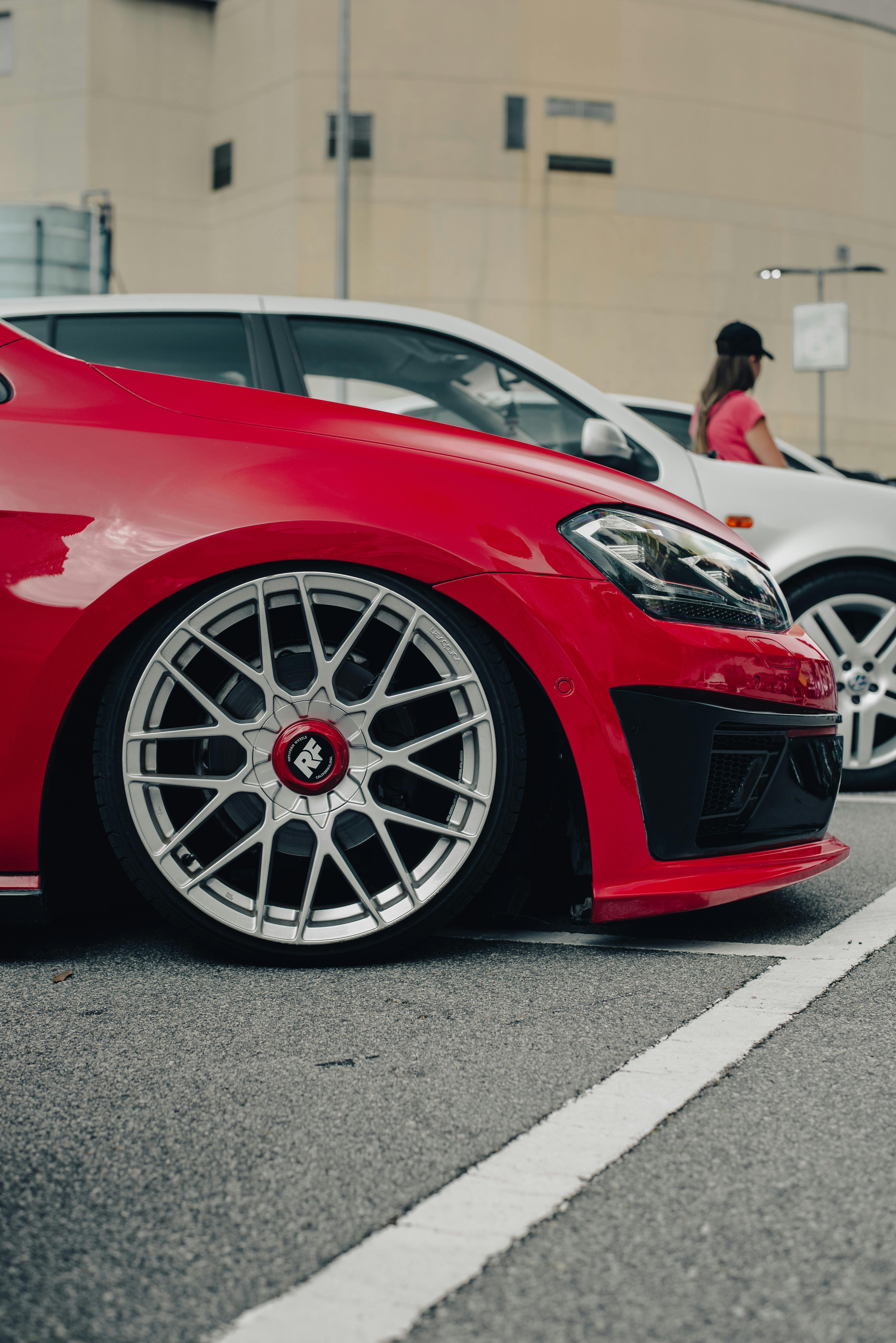 A Parked Black Car with Aftermarket Mags · Free Stock Photo