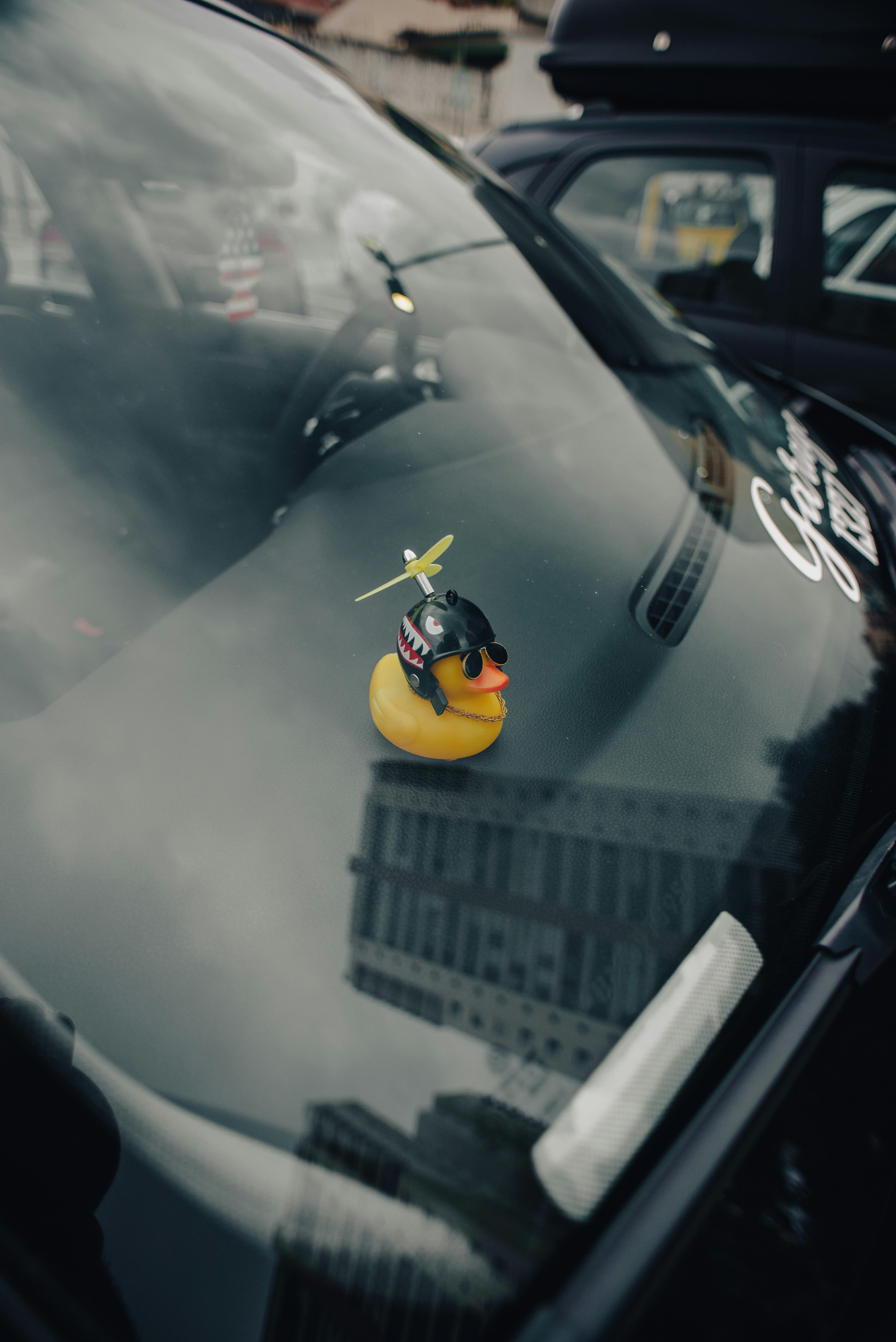 Yellow Rubber Duck on Car Dashboard · Free Stock Photo