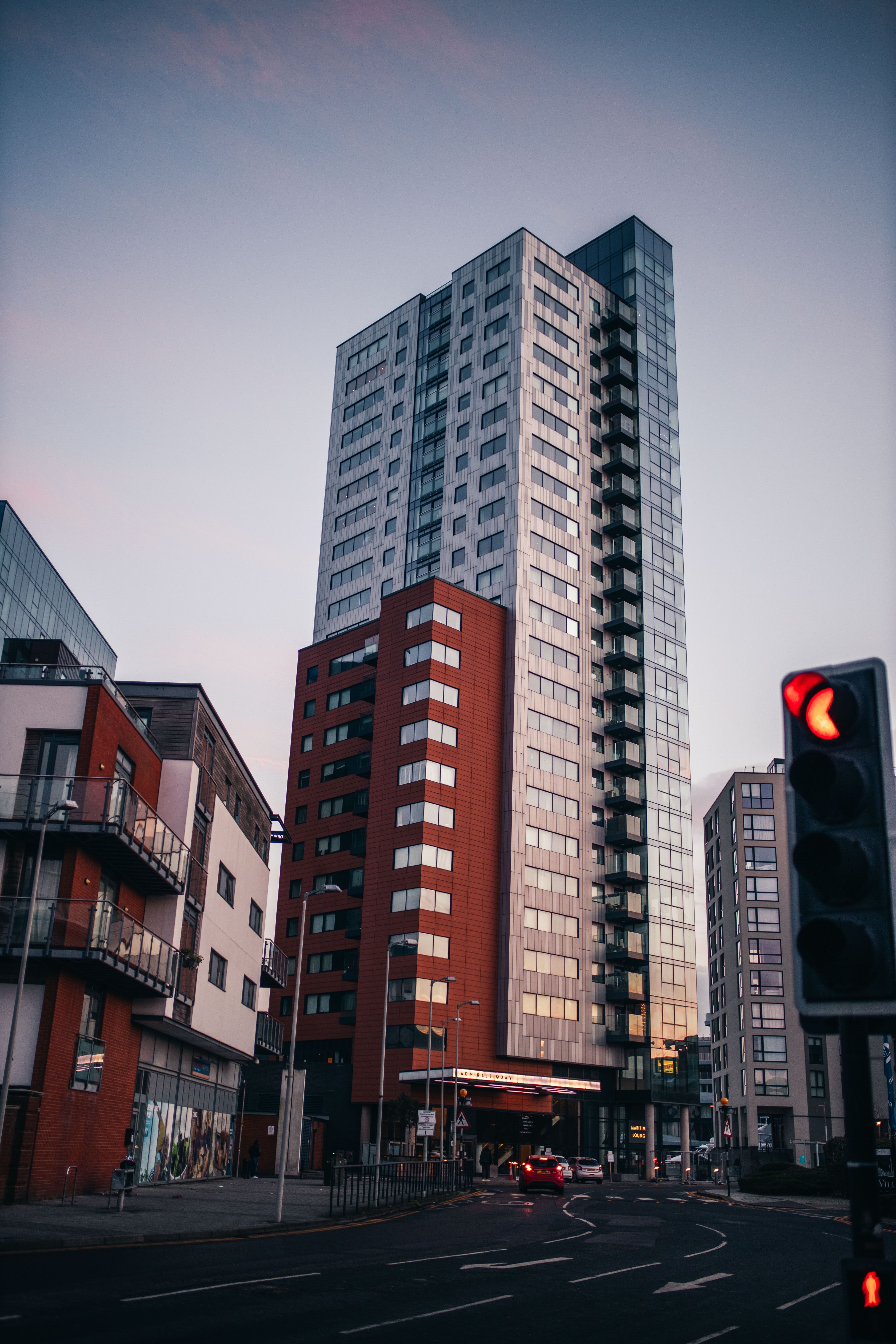 Silhouette of a Man Standing Beside the Building · Free Stock Photo