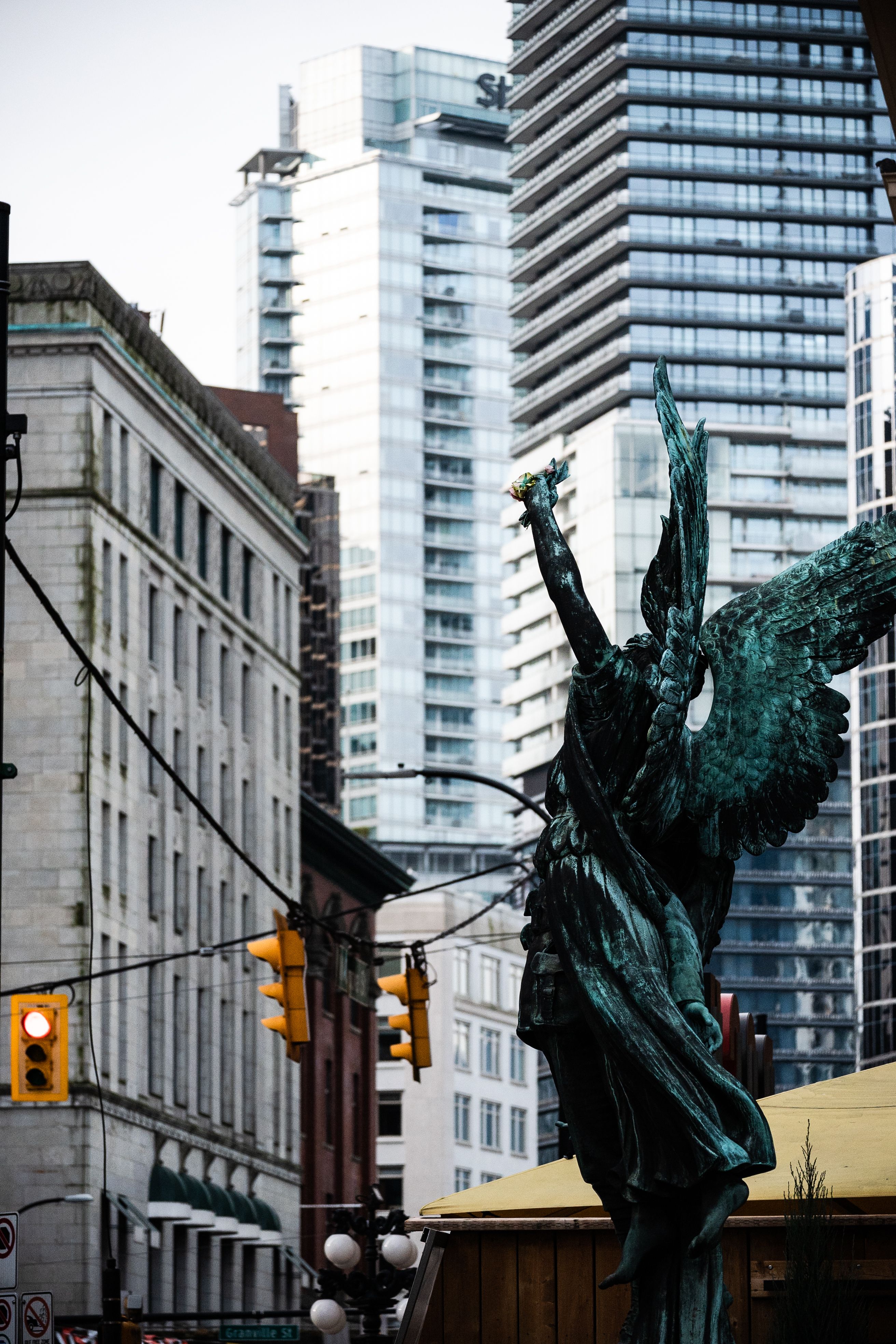 Green Statue Near White Concrete Building · Free Stock Photo