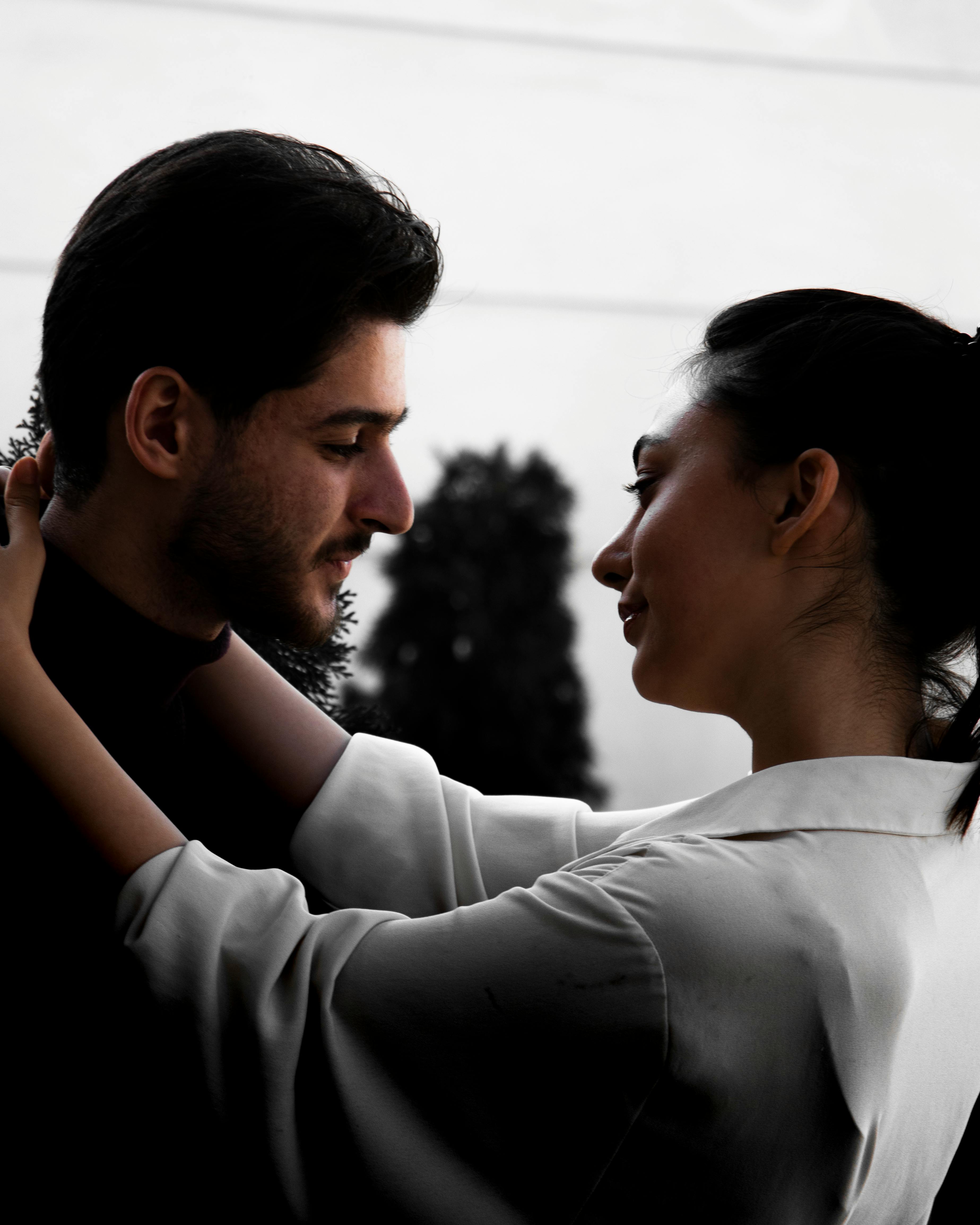 Couple Standing Face to Face Smiling · Free Stock Photo