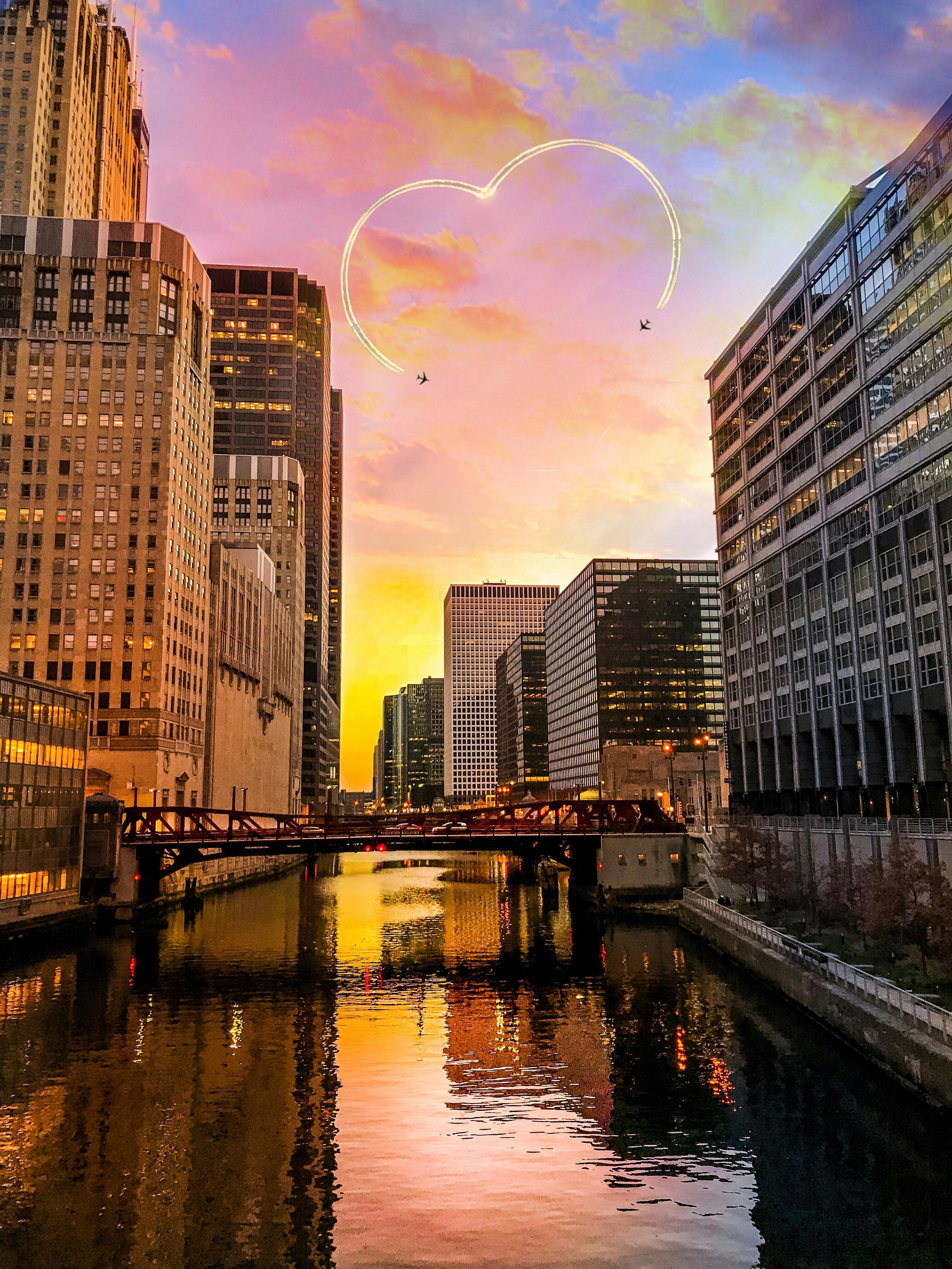 Bridge Over a River Between Buildings · Free Stock Photo