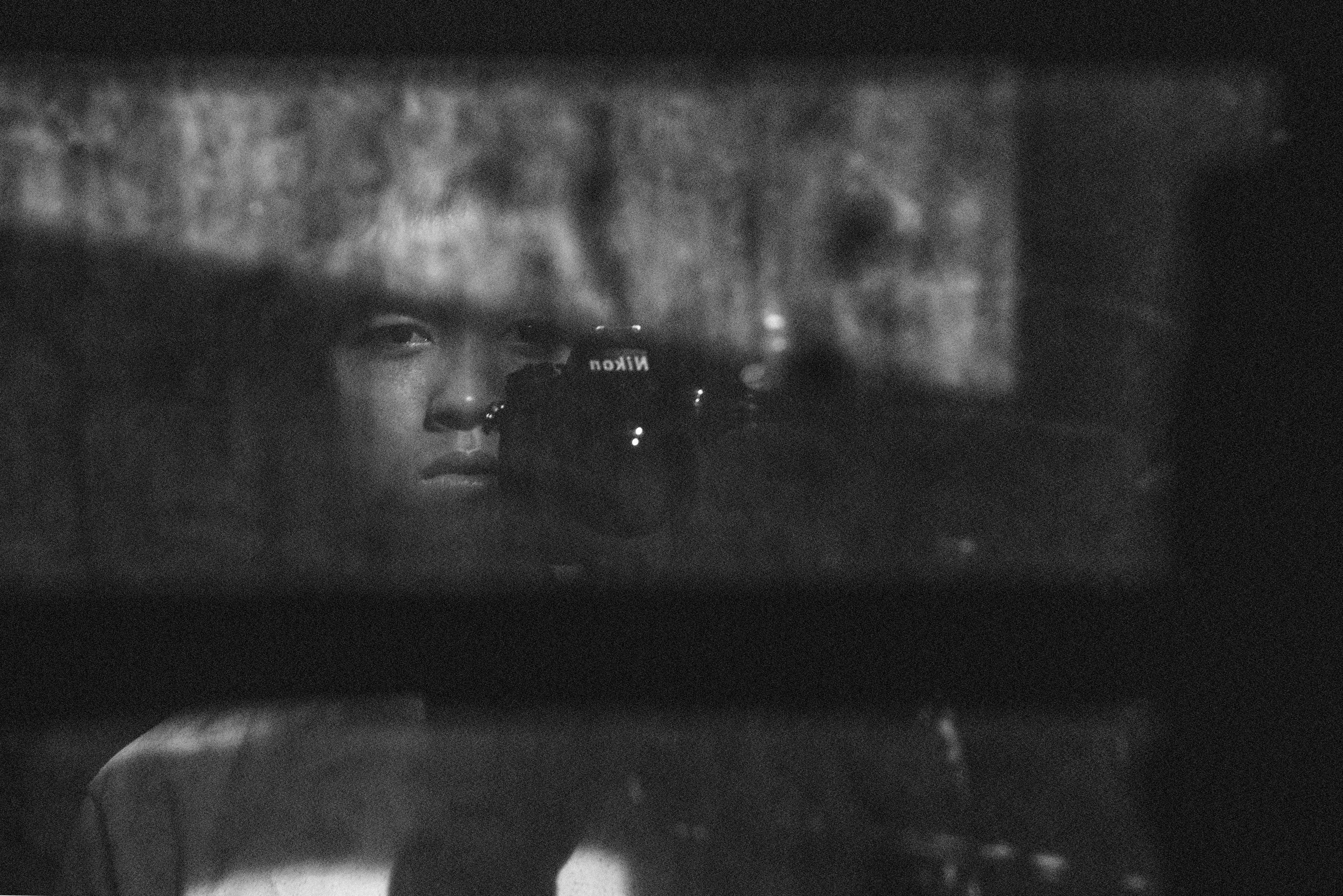 Woman with Camera behind Window · Free Stock Photo