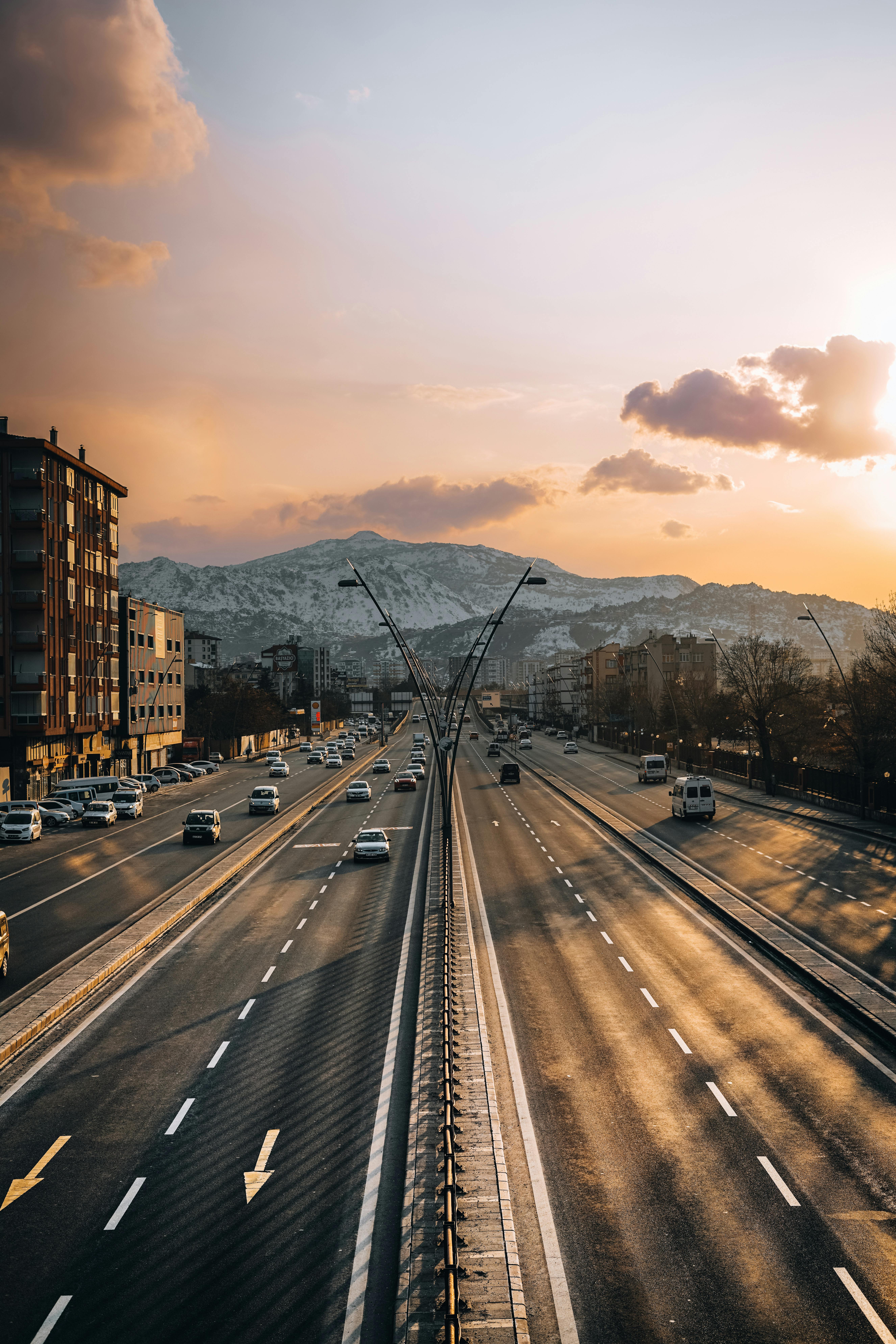 Sunset about Highway in Mountains Landscape · Free Stock Photo
