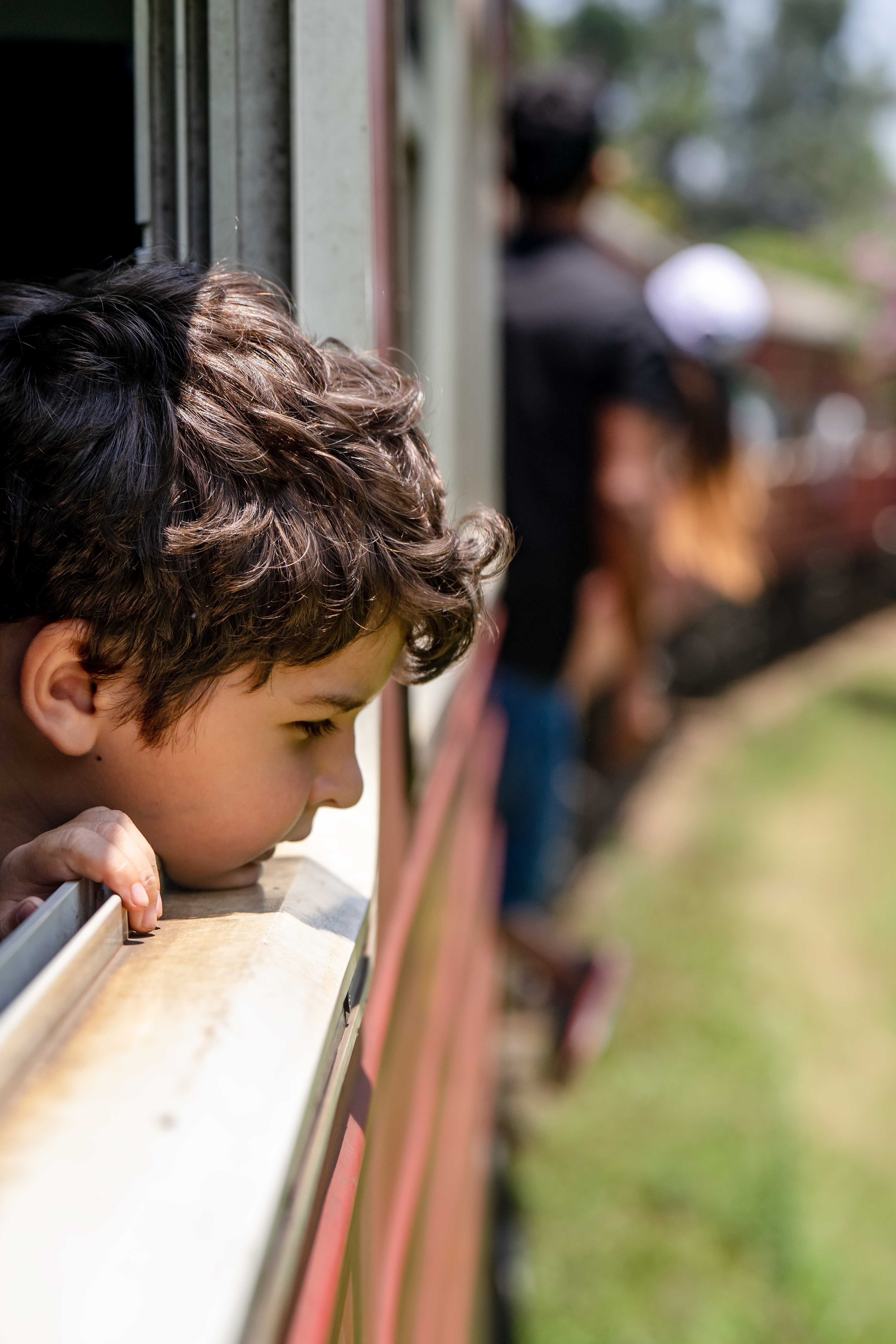 A Boy Looking Out the Window · Free Stock Photo