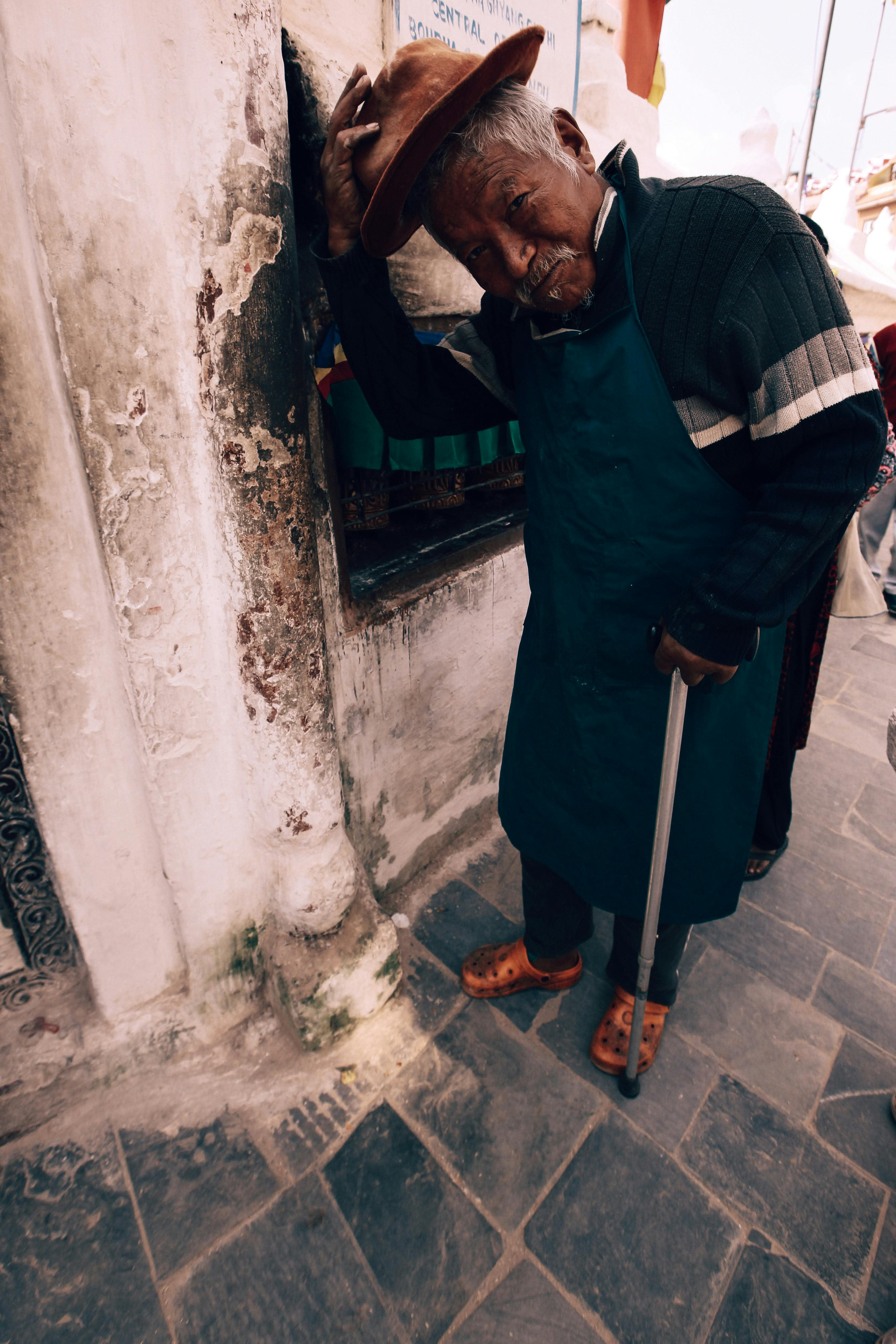 A Man Using Cane While Walking · Free Stock Photo