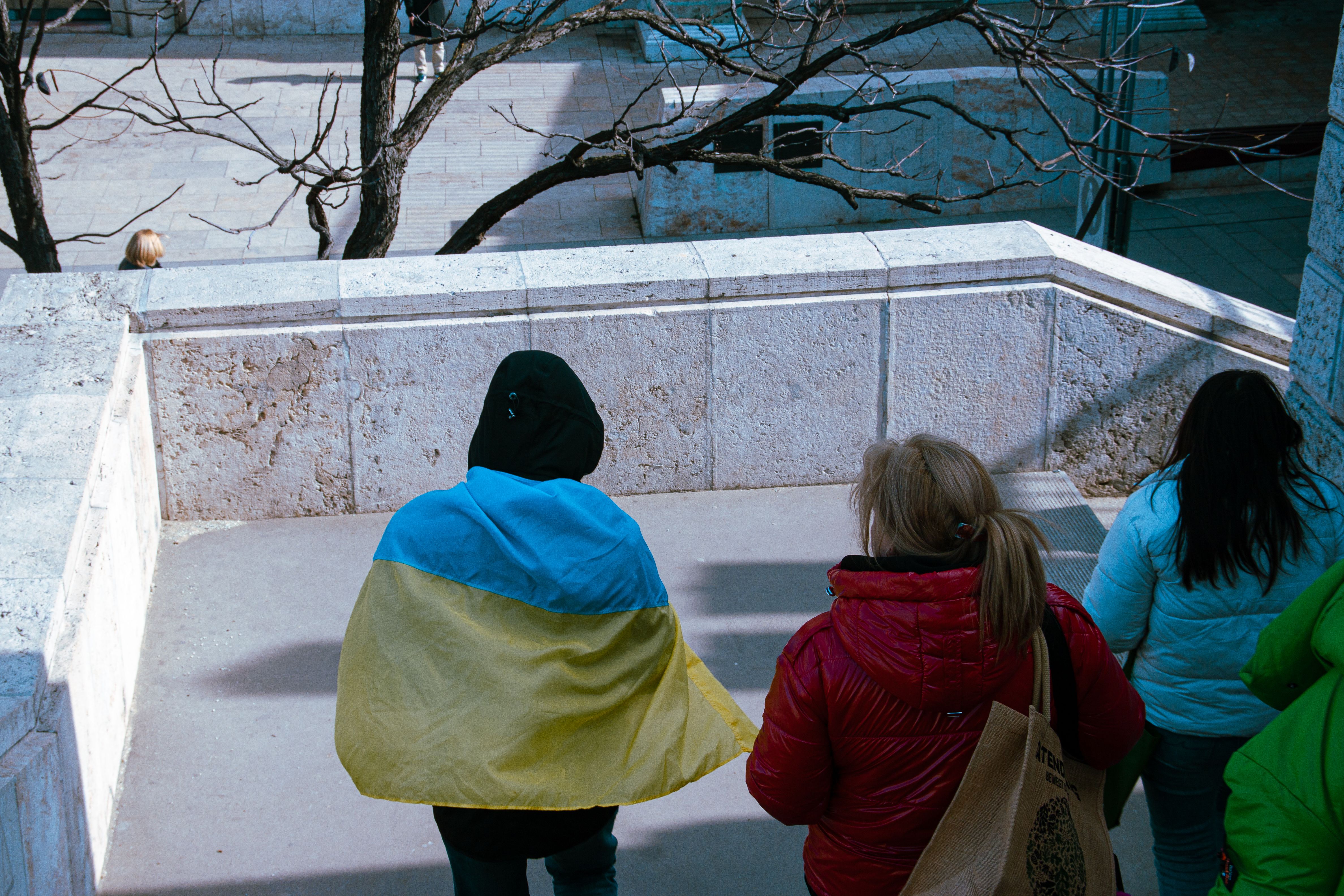 Women in Jackets on Concrete Floor · Free Stock Photo