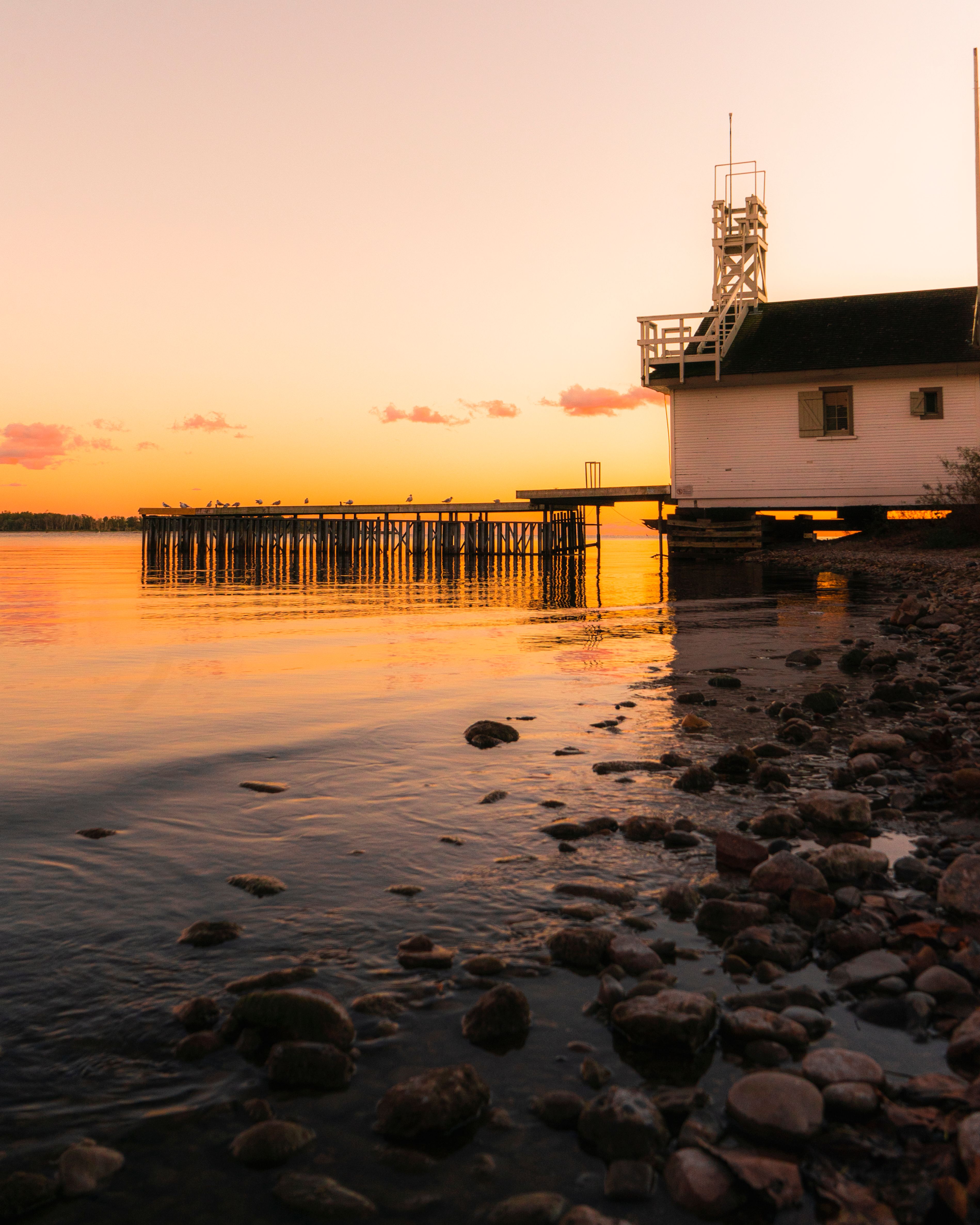 House with Pier by Sea at Sunset · Free Stock Photo