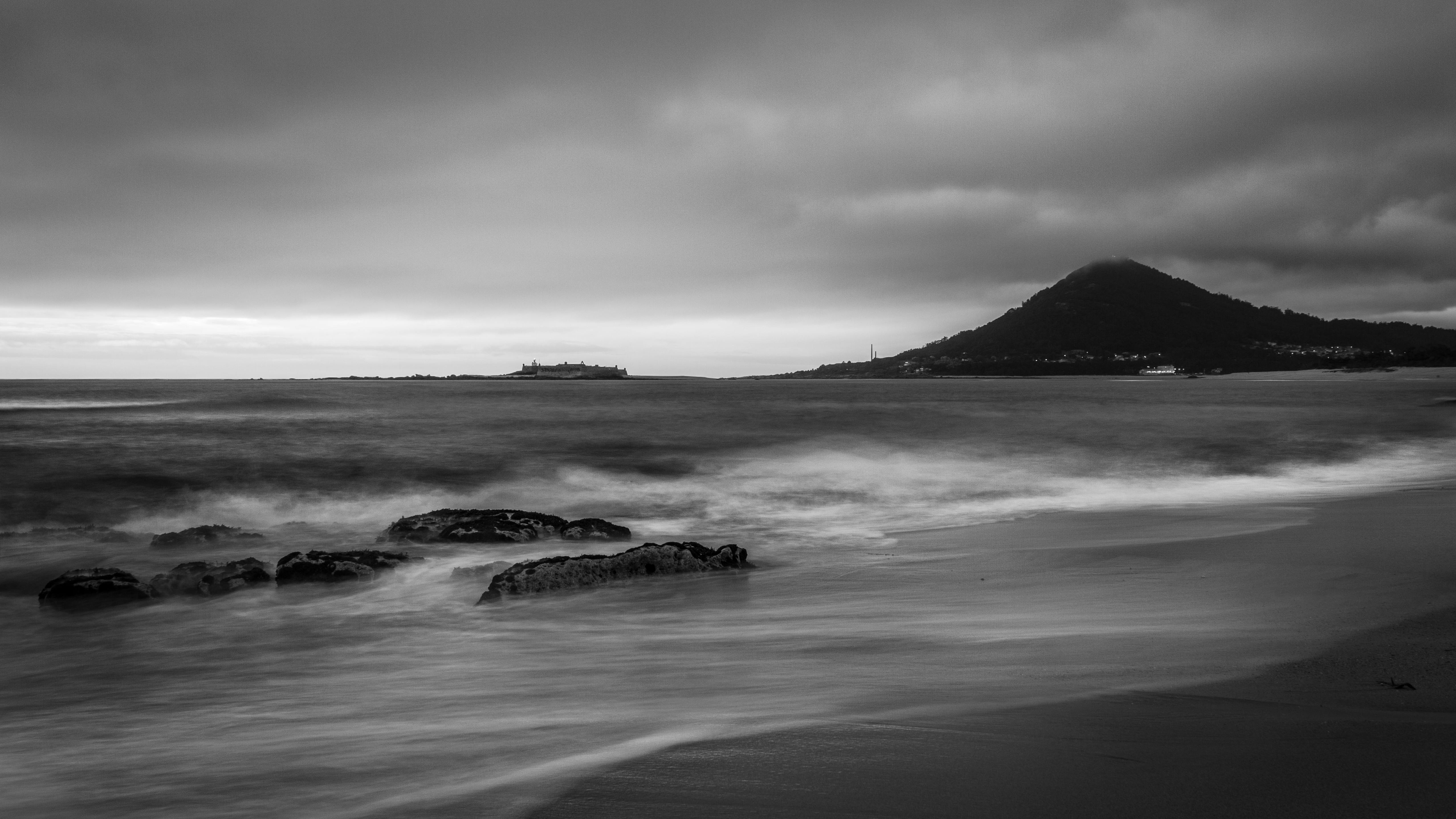 Grayscale Photo of Ocean Waves Crashing on Rocks · Free Stock Photo