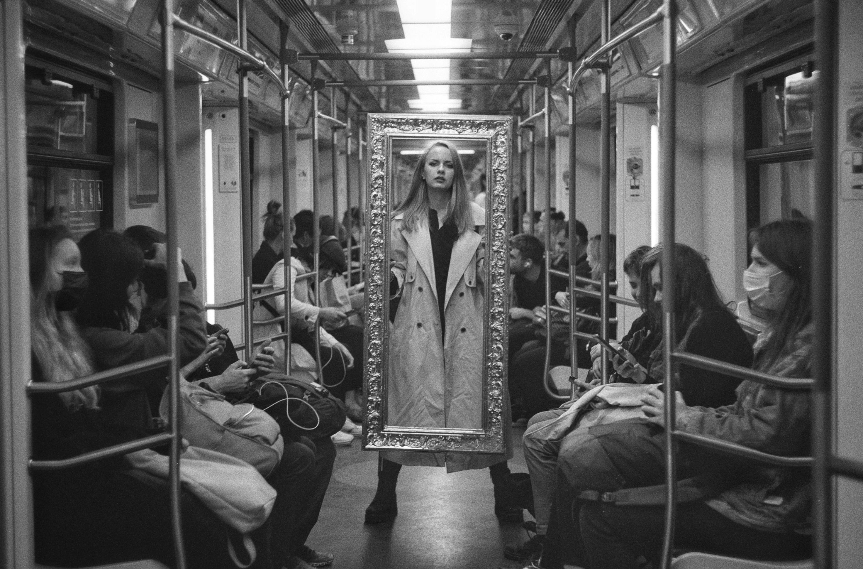 Grayscale Photo of People Inside Train · Free Stock Photo