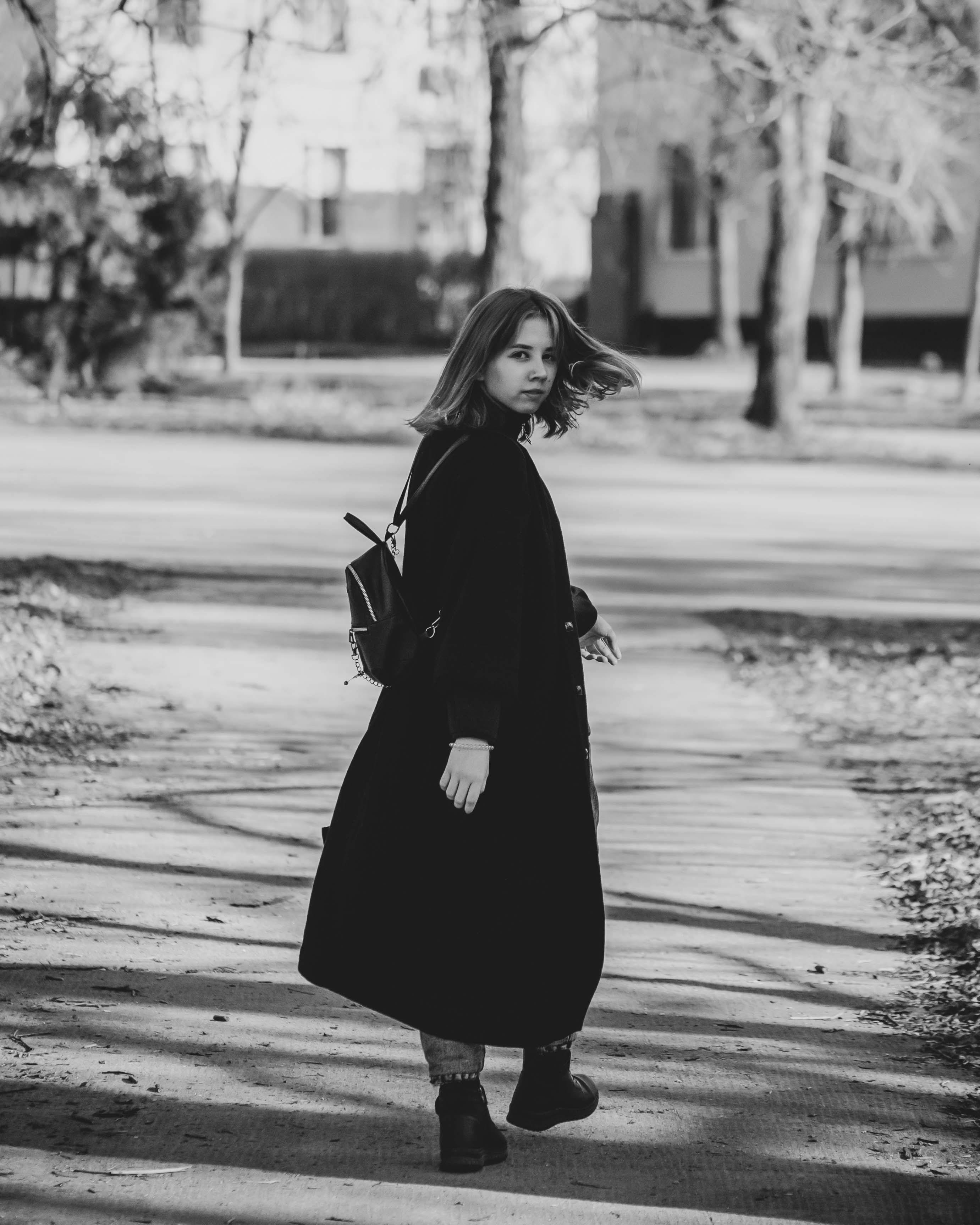 Woman Walking on Sidewalk and Turning Over Shoulder · Free Stock Photo