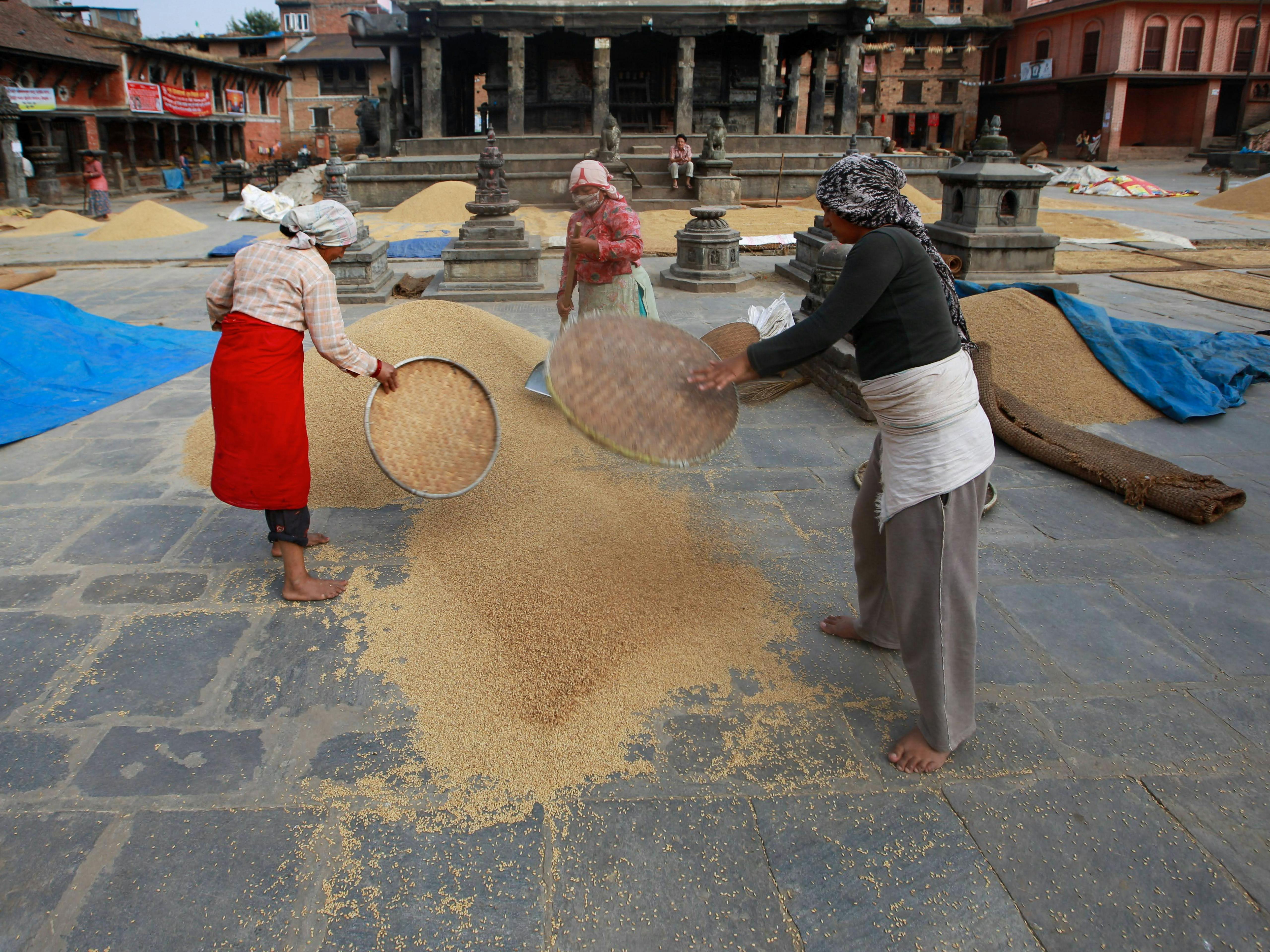 Woman Working By Sifting Sand · Free Stock Photo