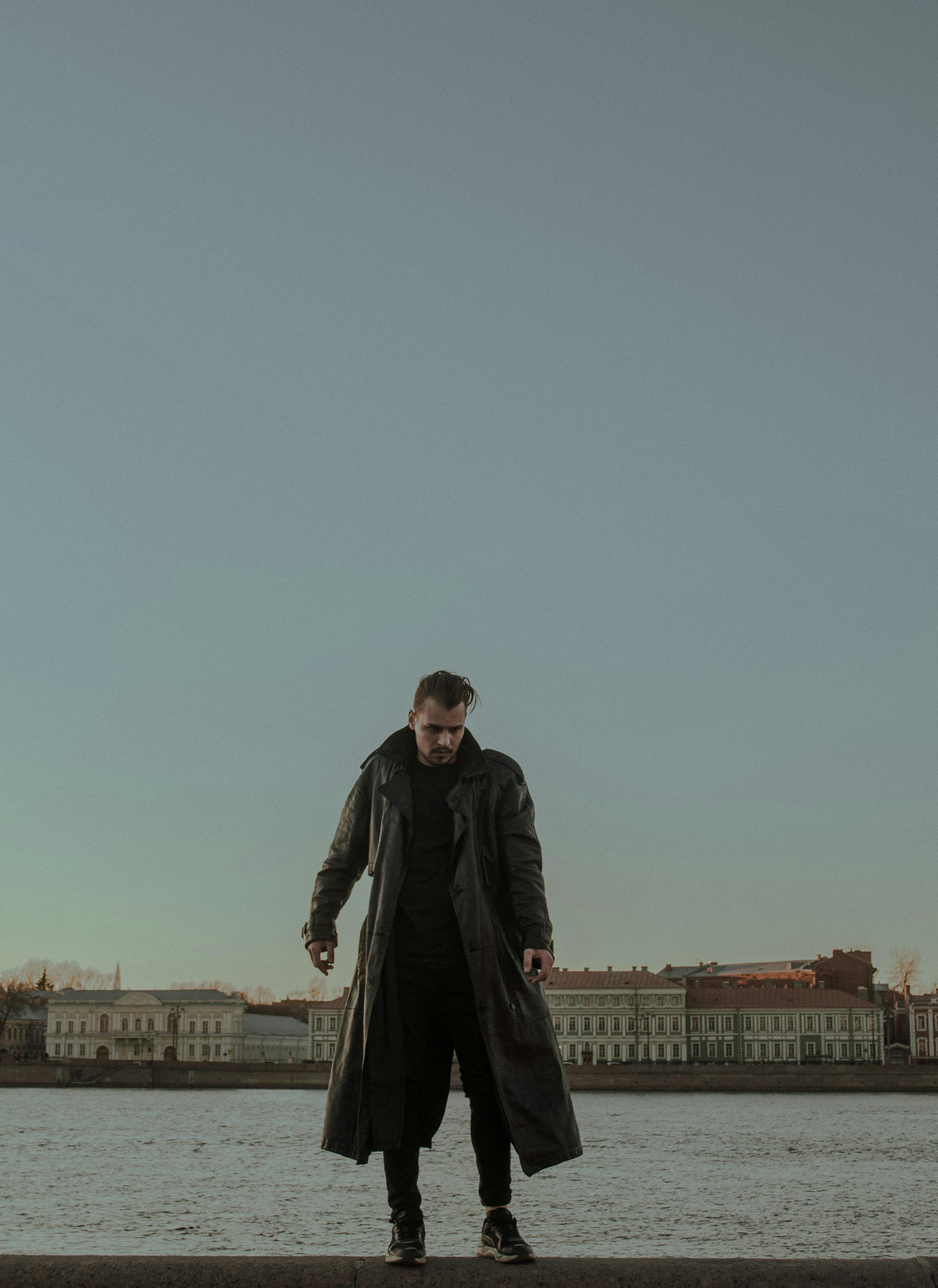 Young Woman Standing by a Frozen Body of Water · Free Stock Photo