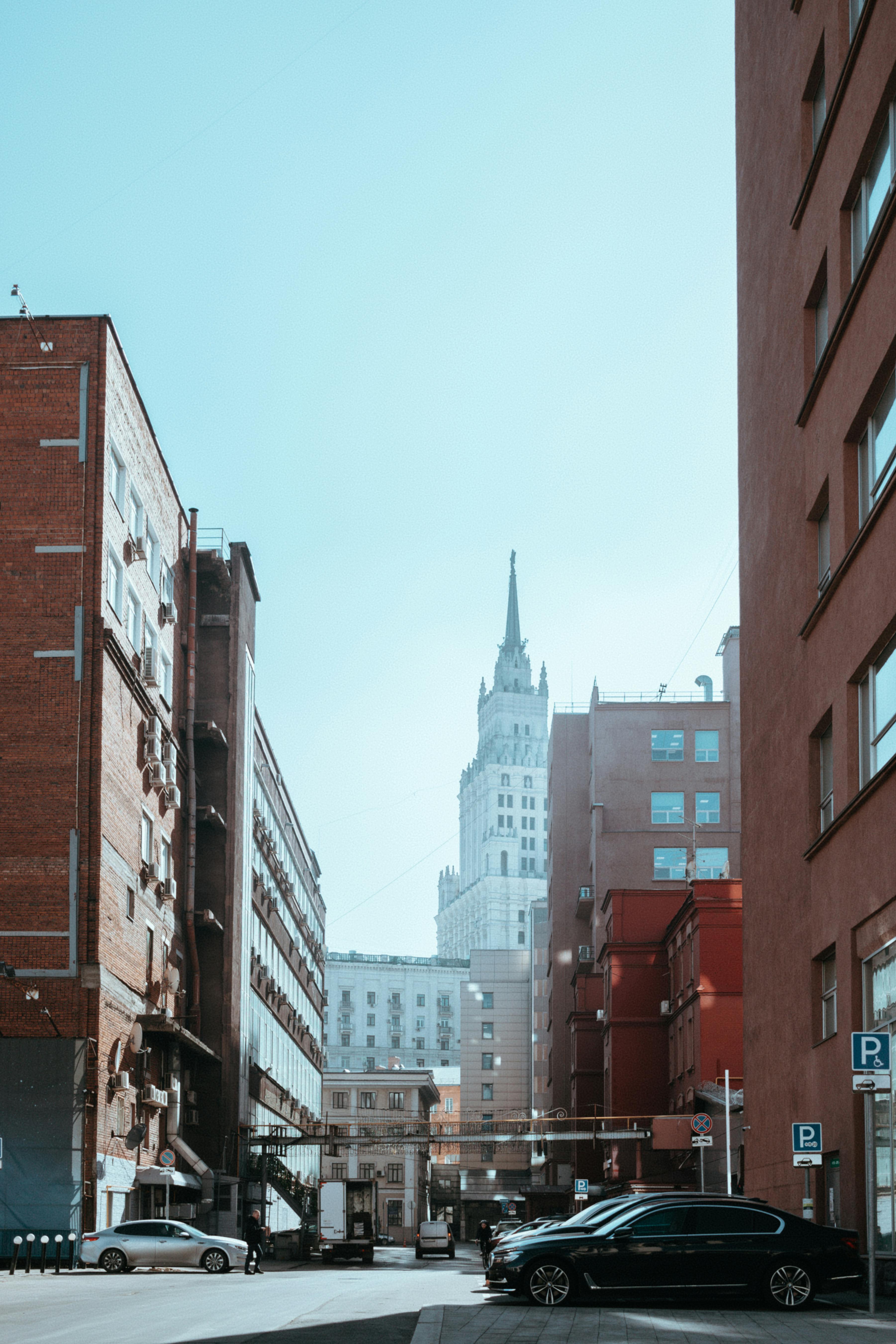 City Street and a Tower Between Buildings · Free Stock Photo