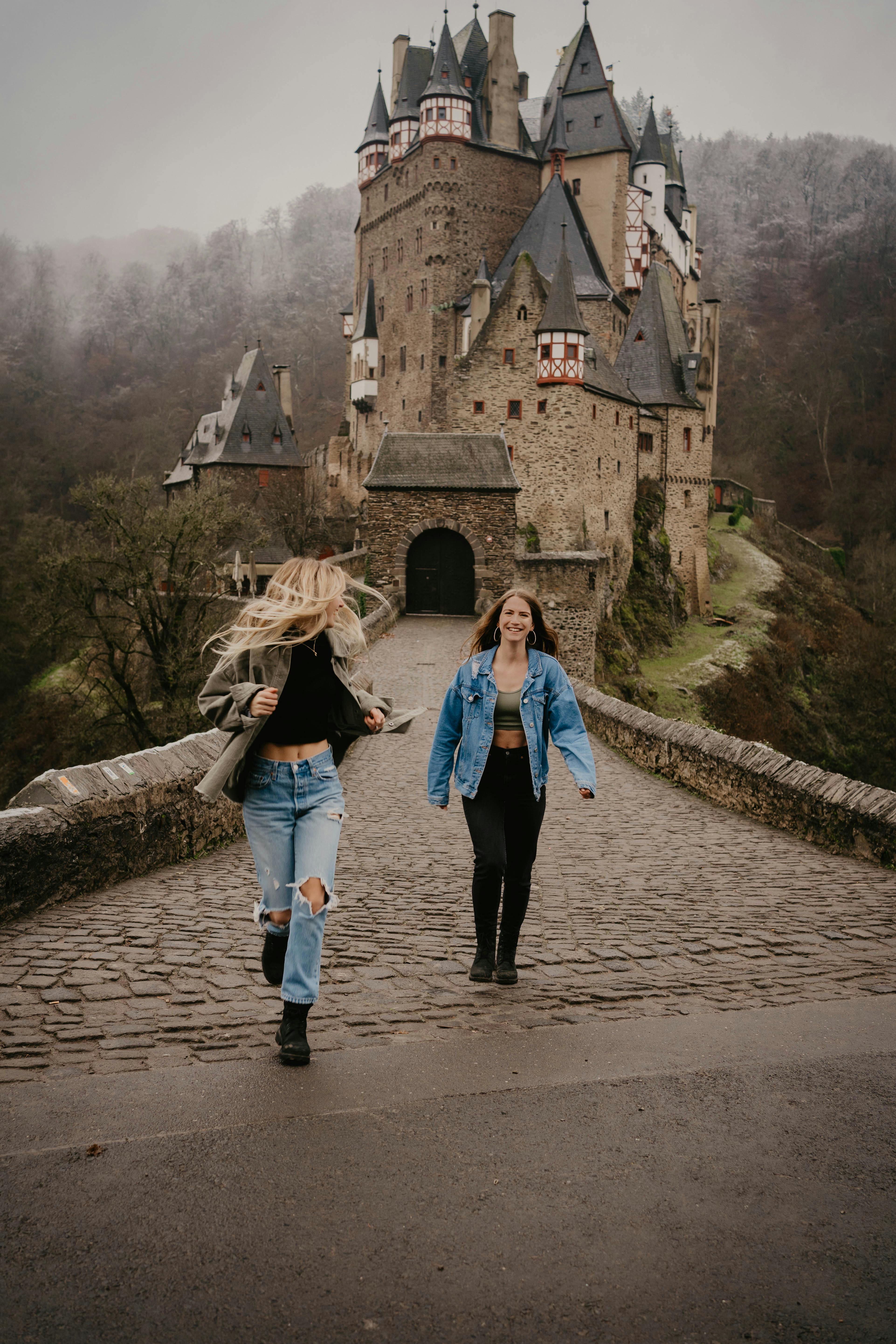 Two Women in front of Castle · Free Stock Photo
