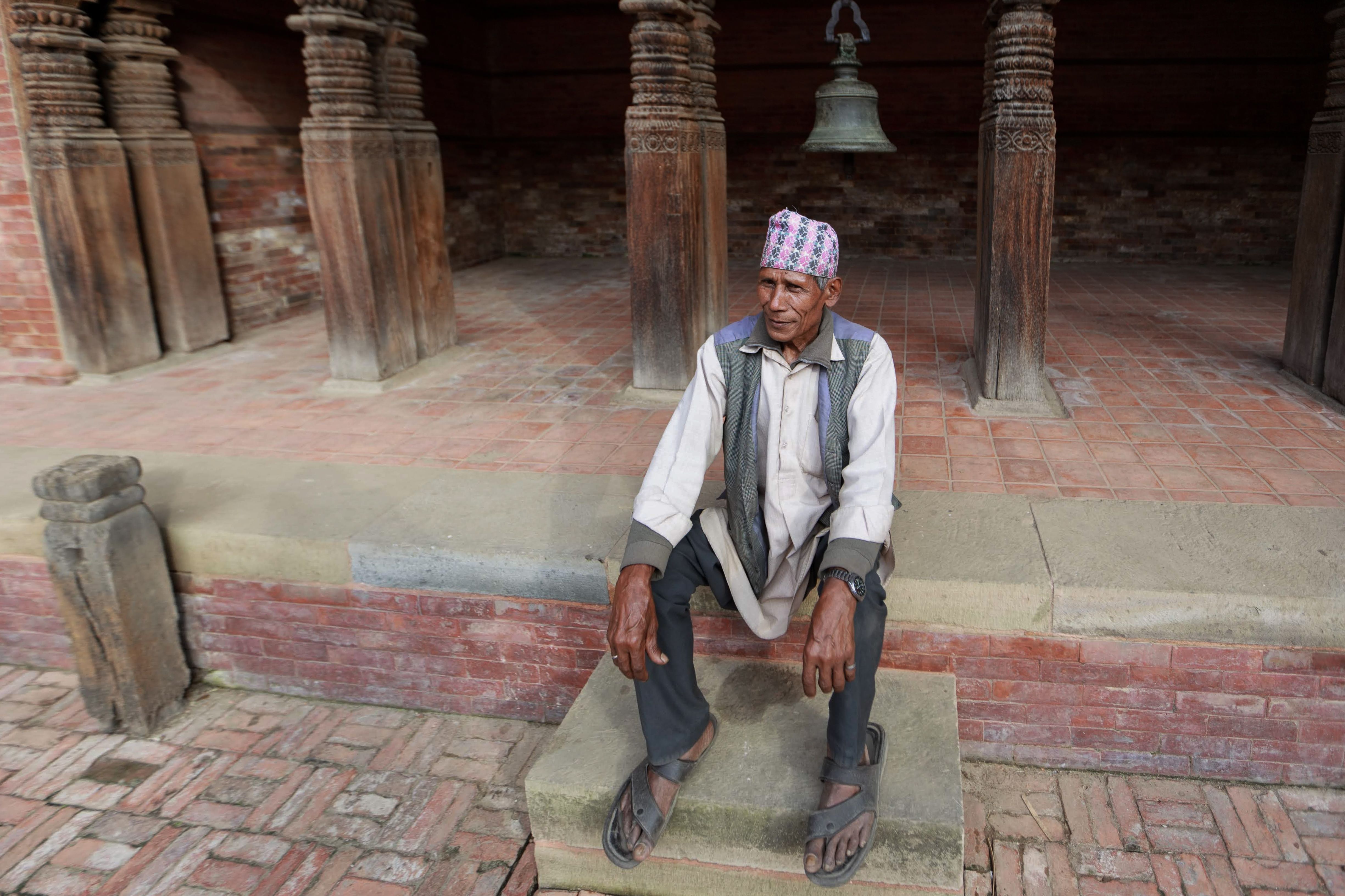 Man Sitting On the Steps In Front Of the Temple · Free Stock Photo