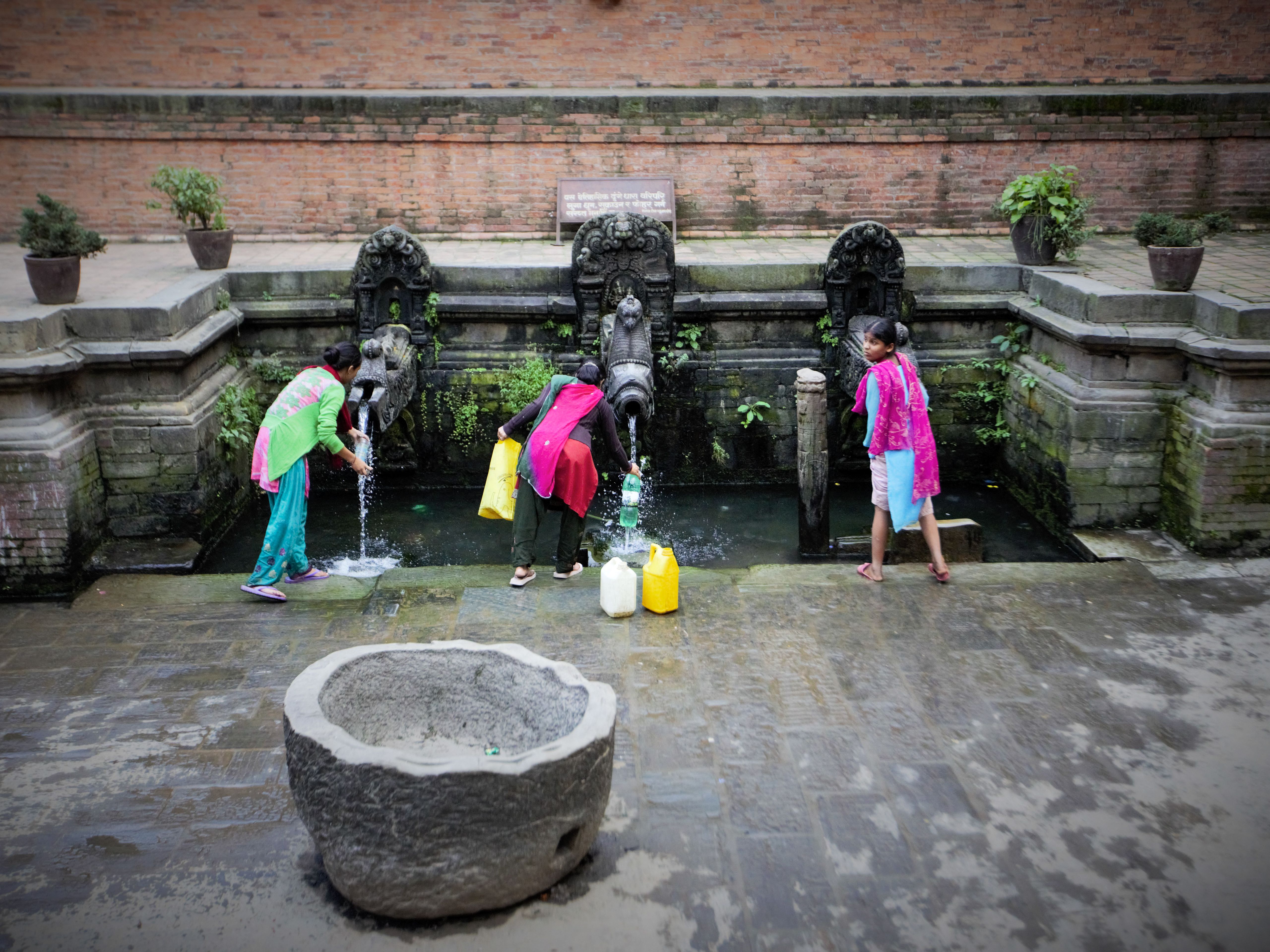 Women Collecting Water · Free Stock Photo