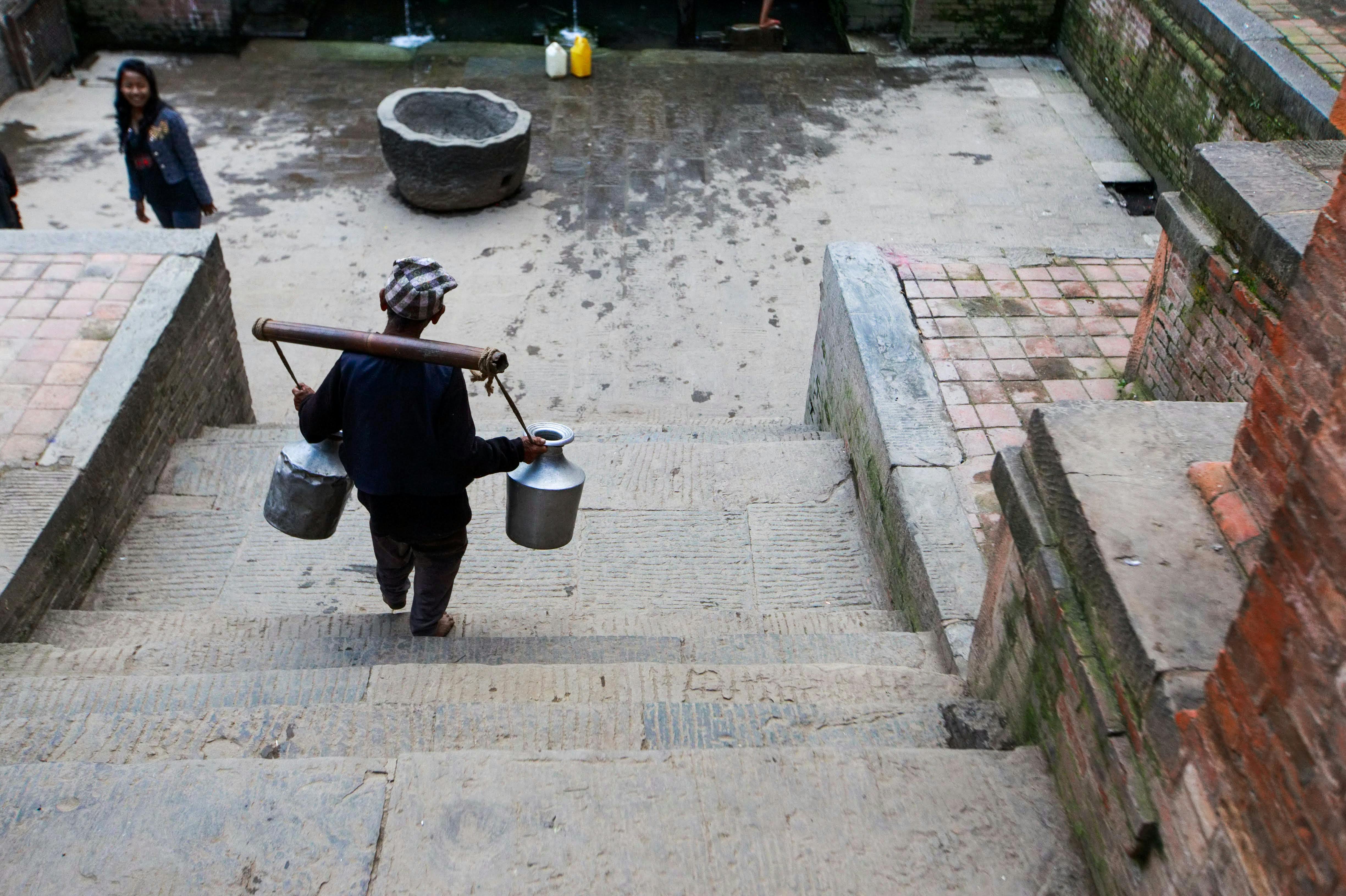 Man Carrying Bar with Flames on Shore in Night Darkness · Free Stock Photo