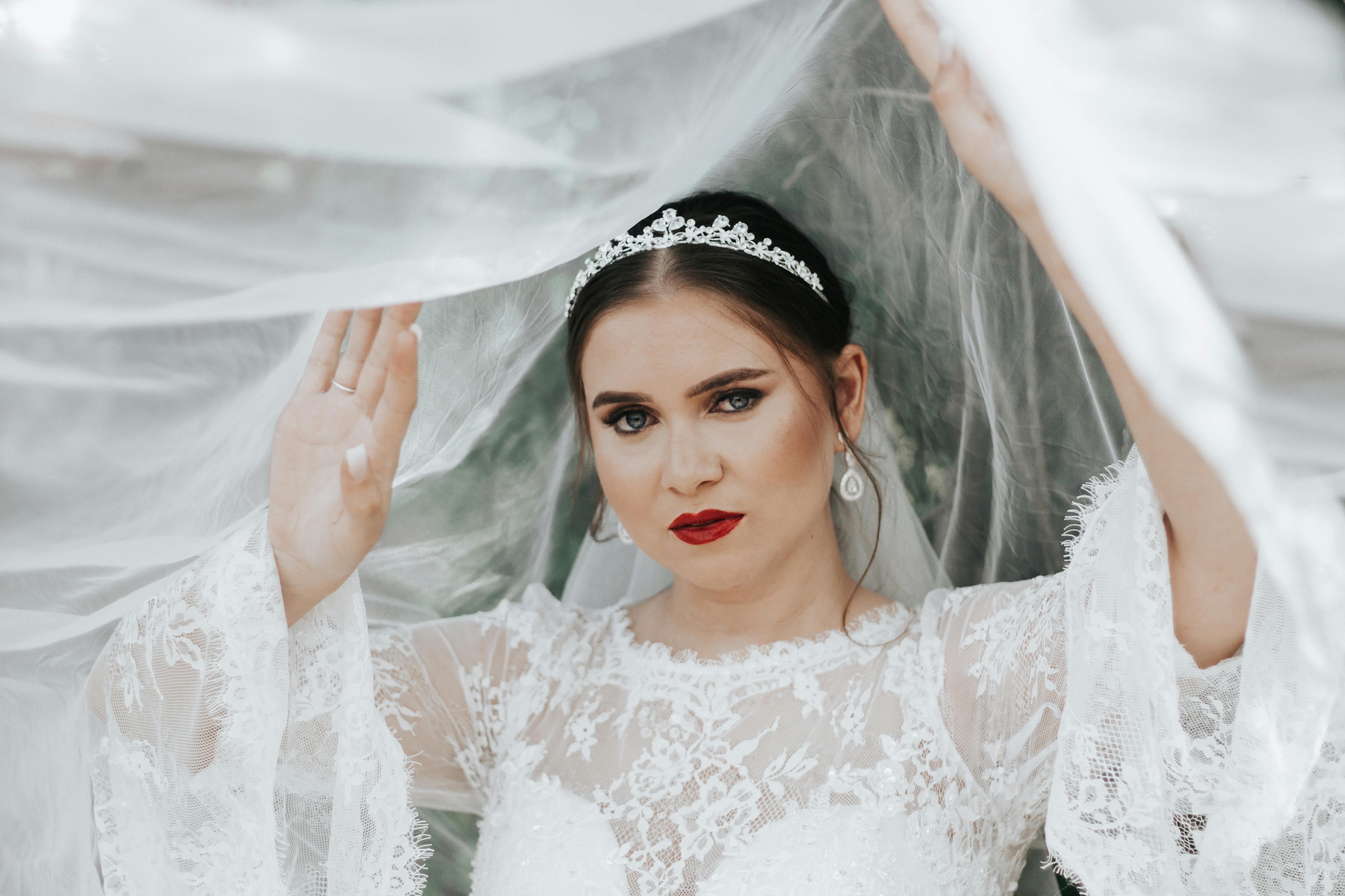 Bride Lifting up Her Veil · Free Stock Photo