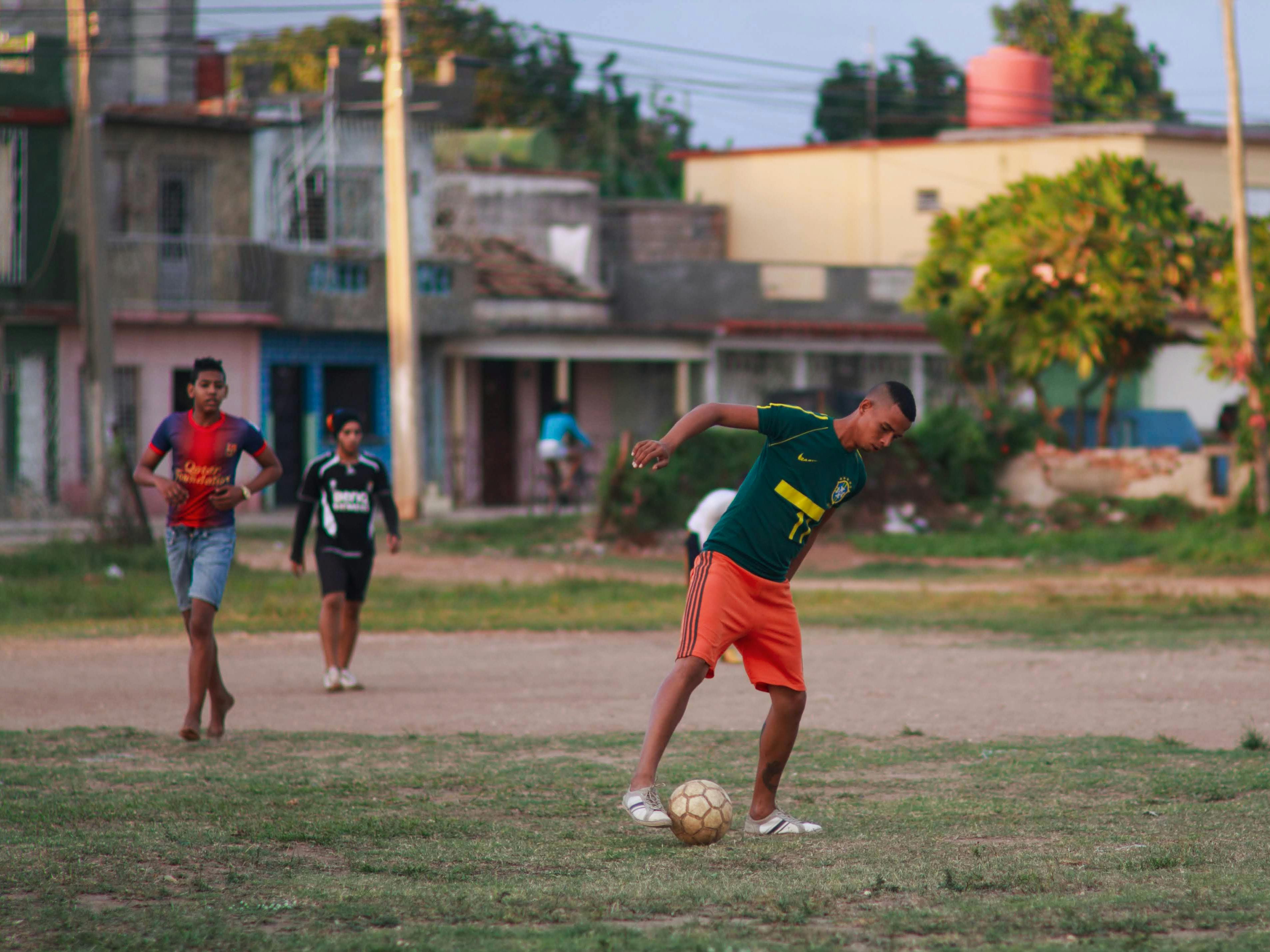 Men Playing Soccer at the Street · Free Stock Photo