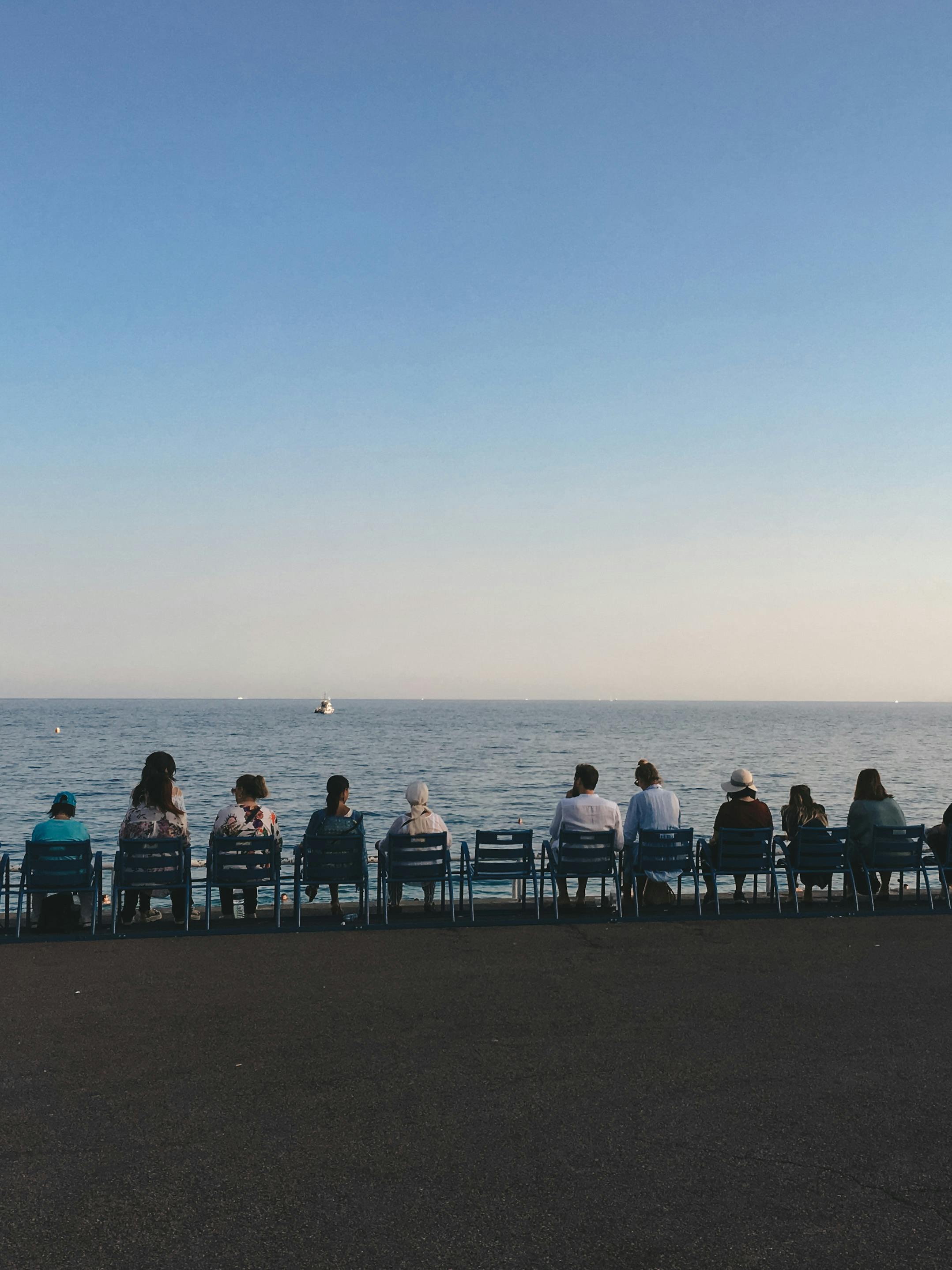 People Sitting on Chair on Beach · Free Stock Photo