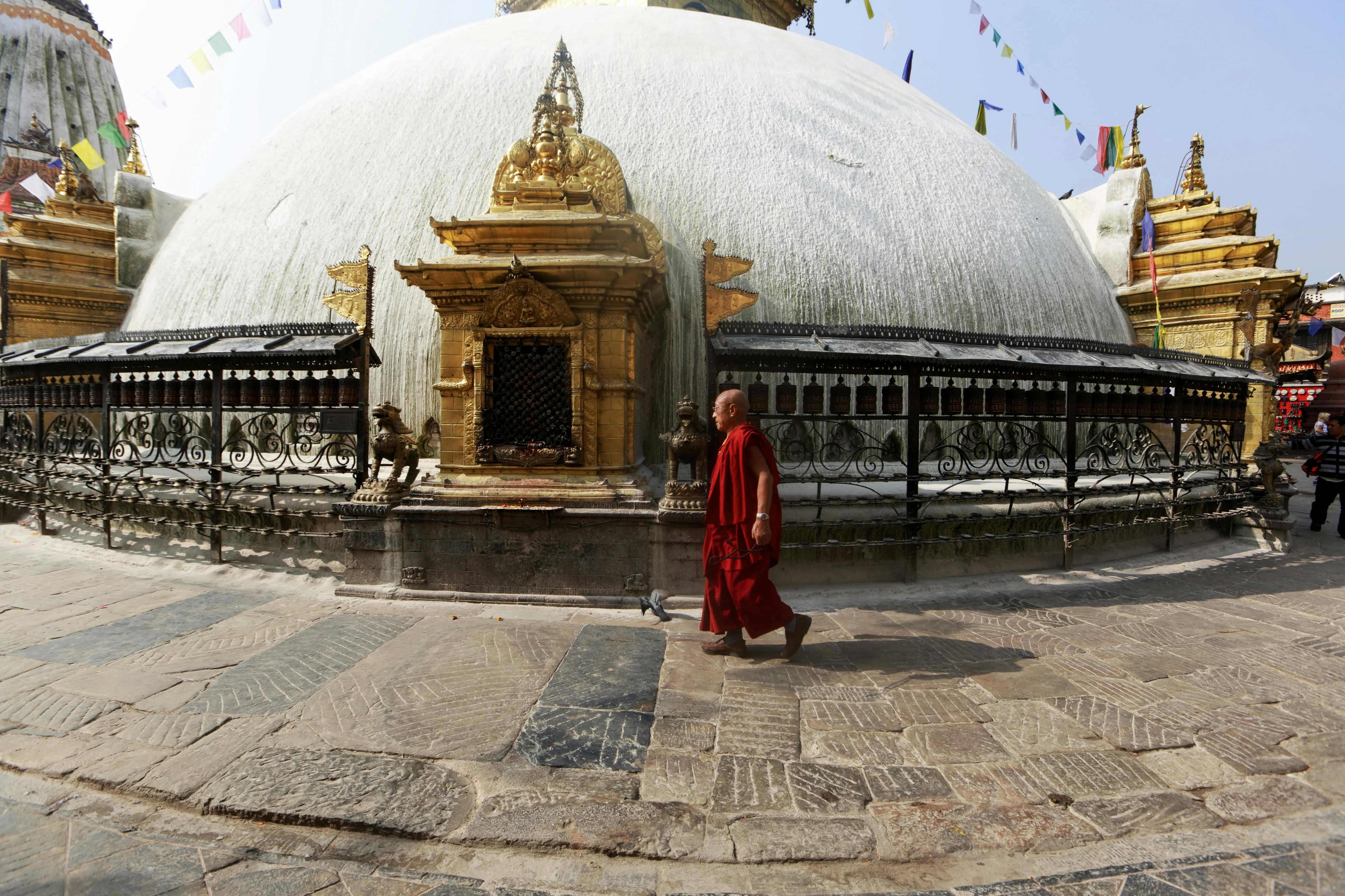 Buddhist Monks Walking around Temple Walls · Free Stock Photo