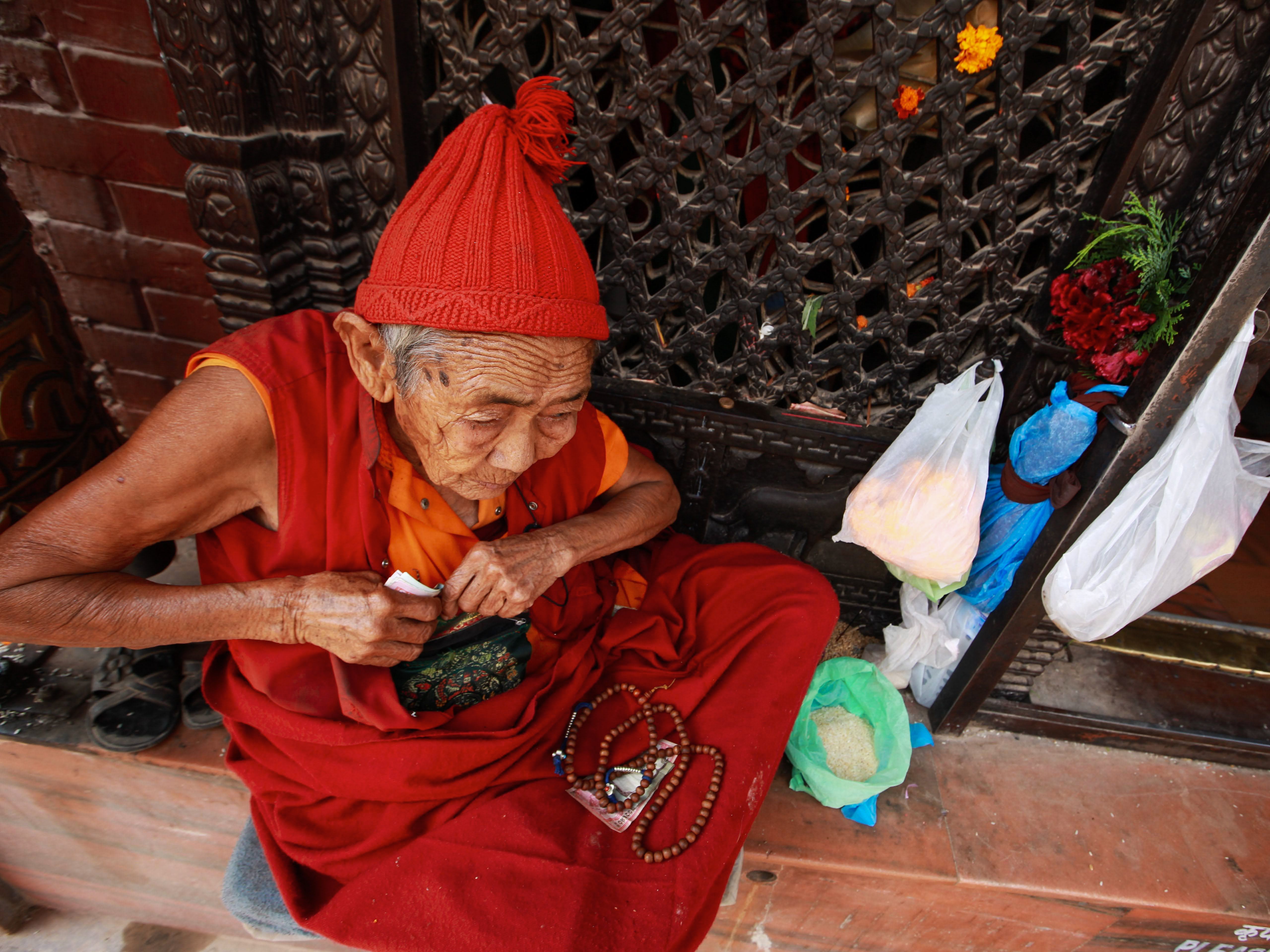 Monks Sitting in Traditional Clothing · Free Stock Photo